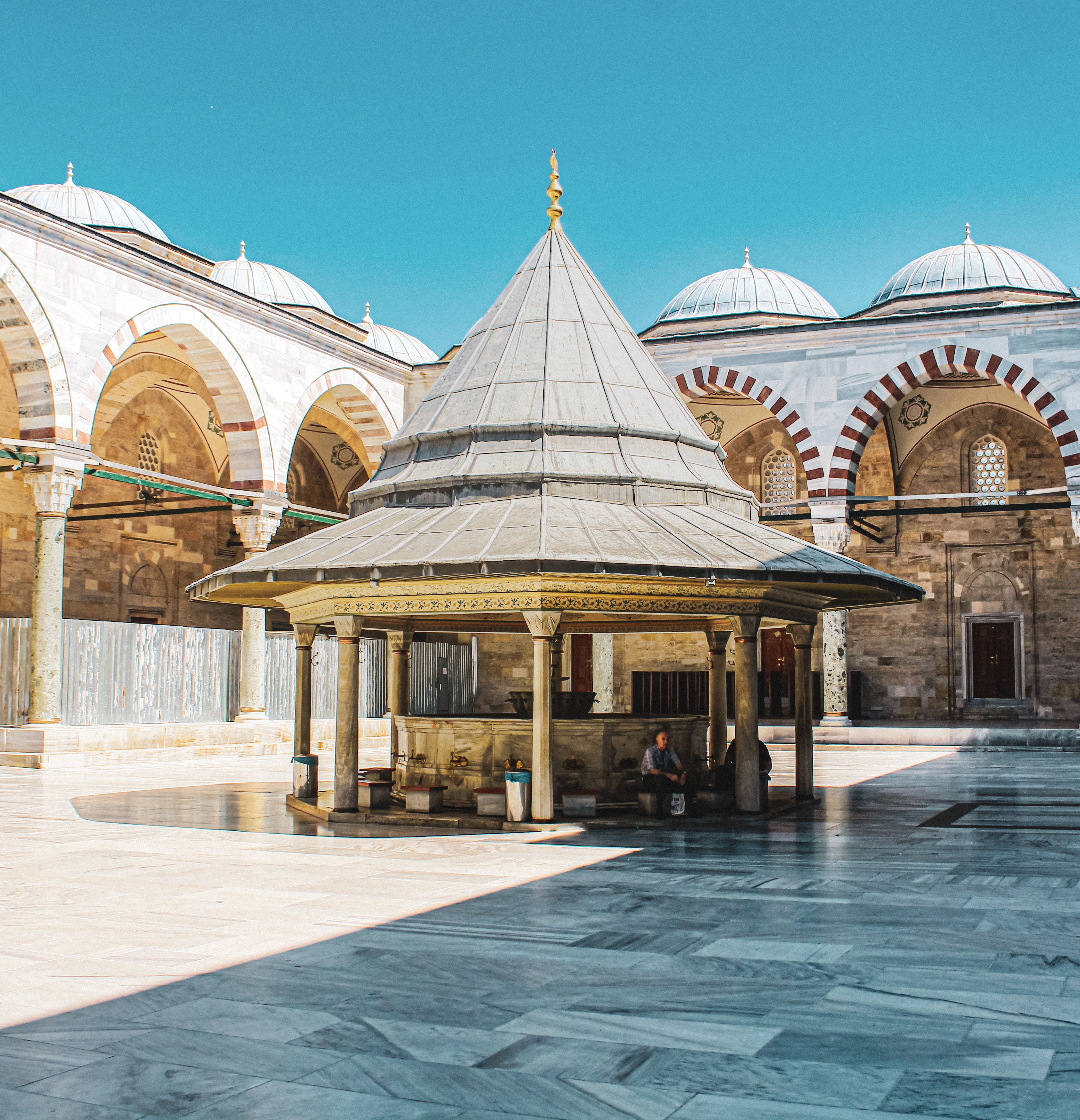 Courtyard and arched passage of medieval mosque · Free Stock Photo