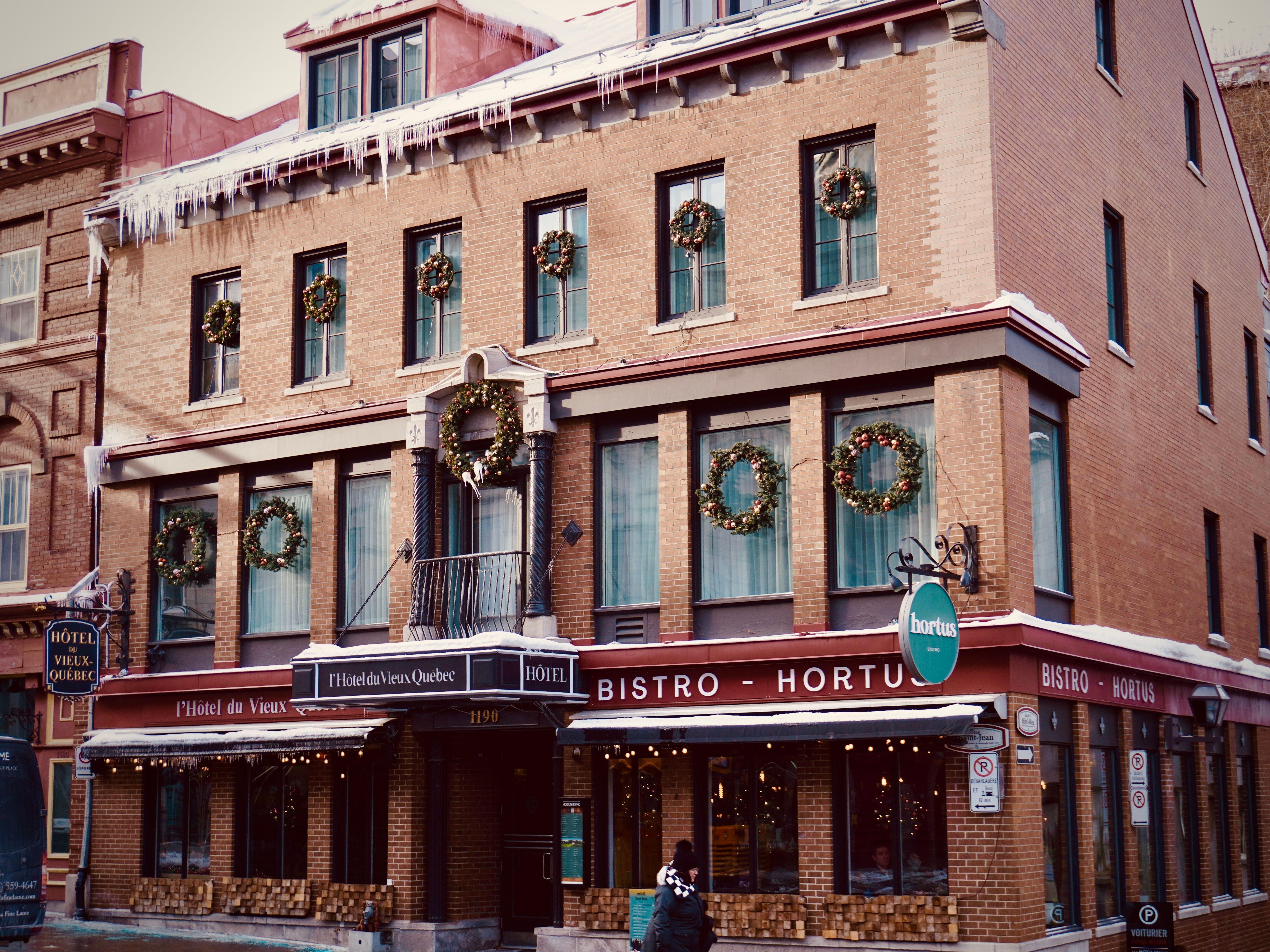 Charming Brick Hotel with Winter Decorations · Free Stock Photo
