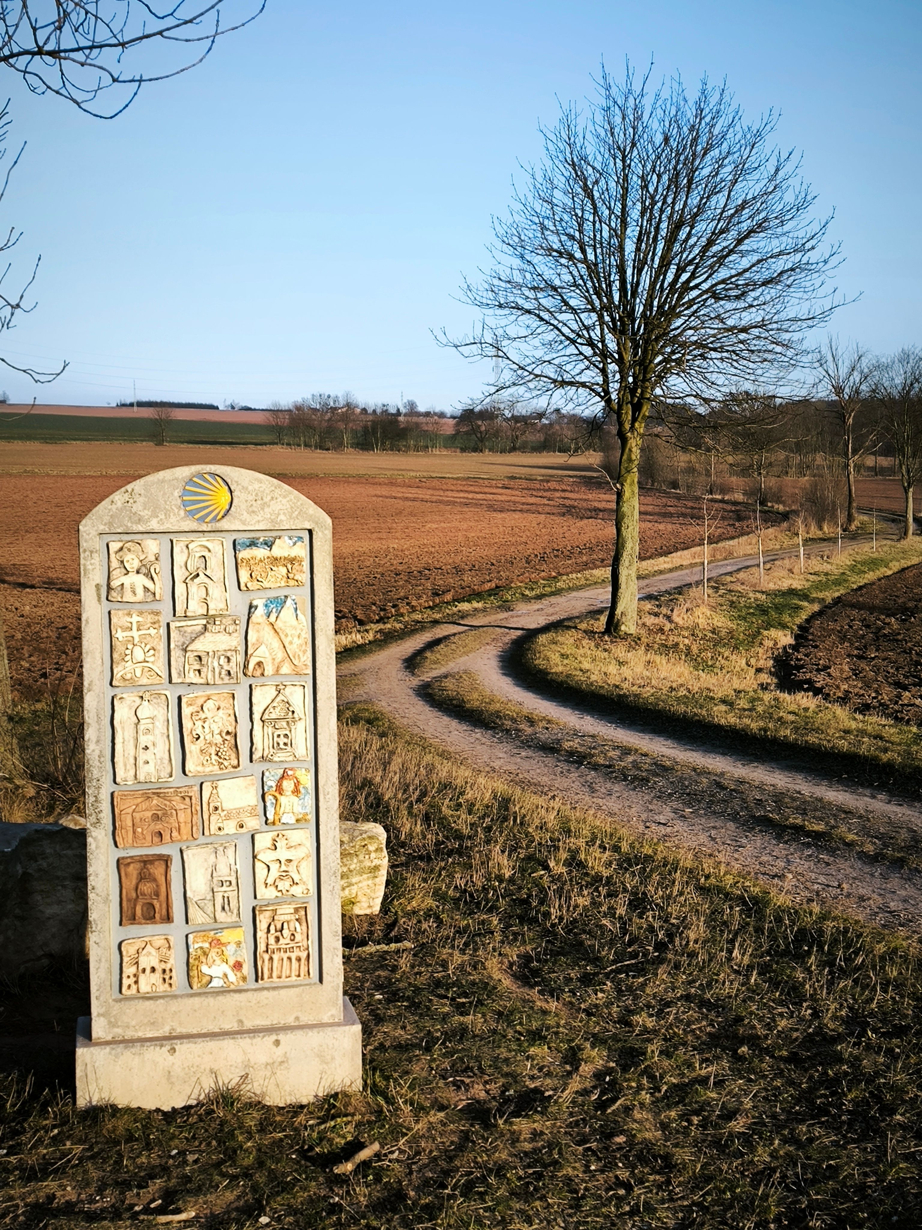 Scenic Rural Landscape with Artistic Tile Monument · Free Stock Photo