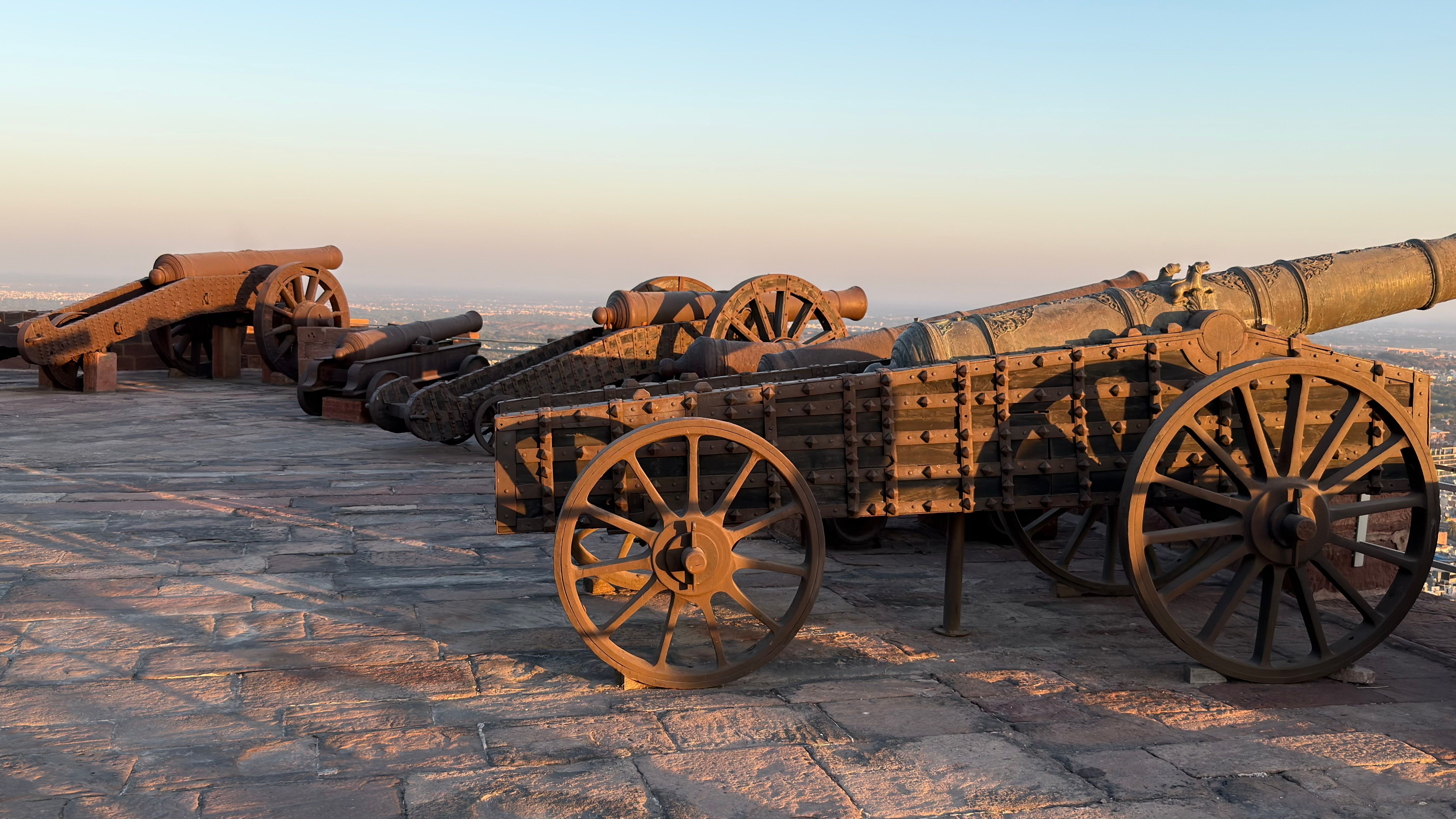 Historic Cannons at Sunset on Stone Fortification · Free Stock Photo