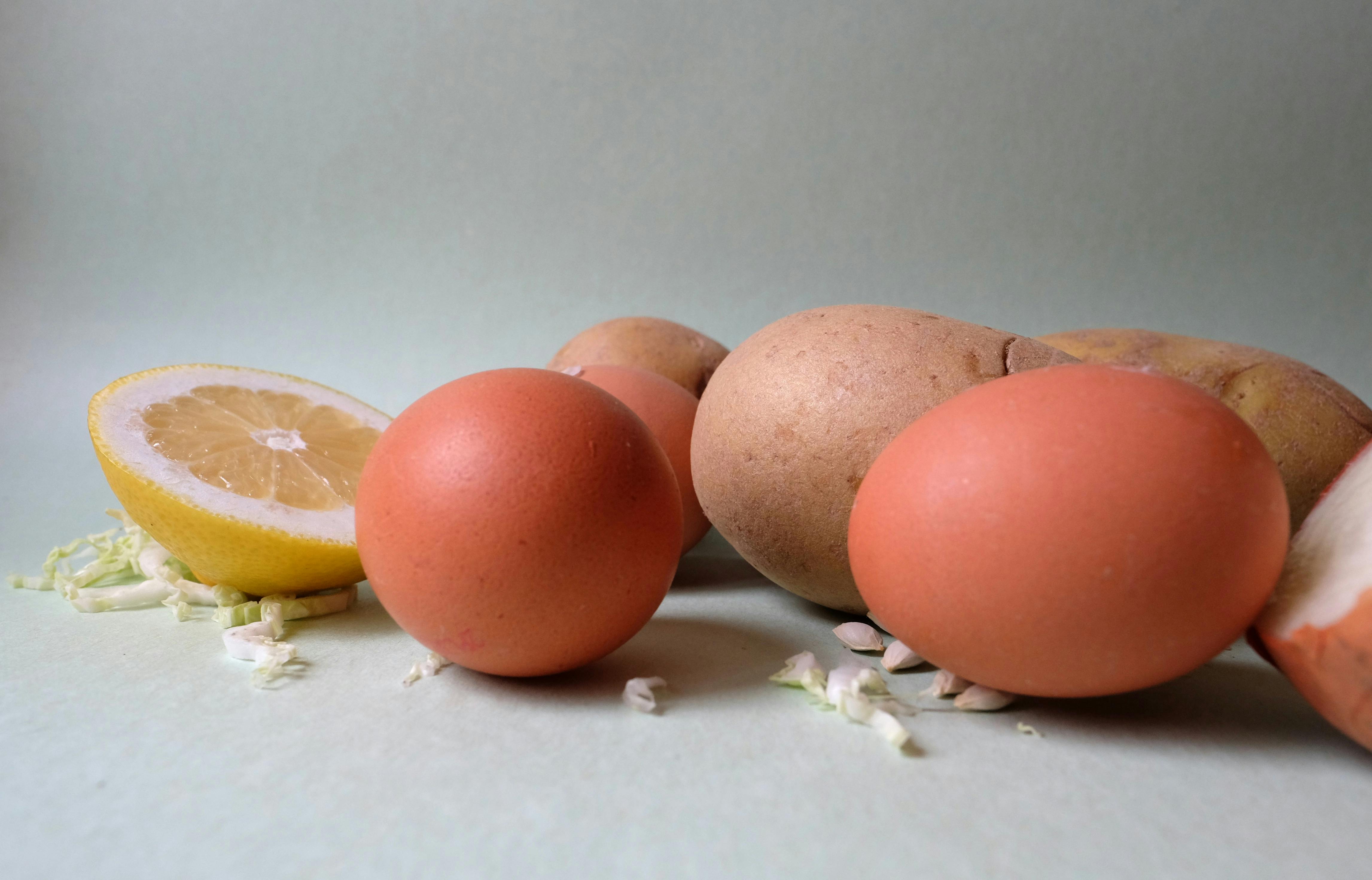 Close-up of Eggs, Lemon, and Potatoes on Surface · Free Stock Photo