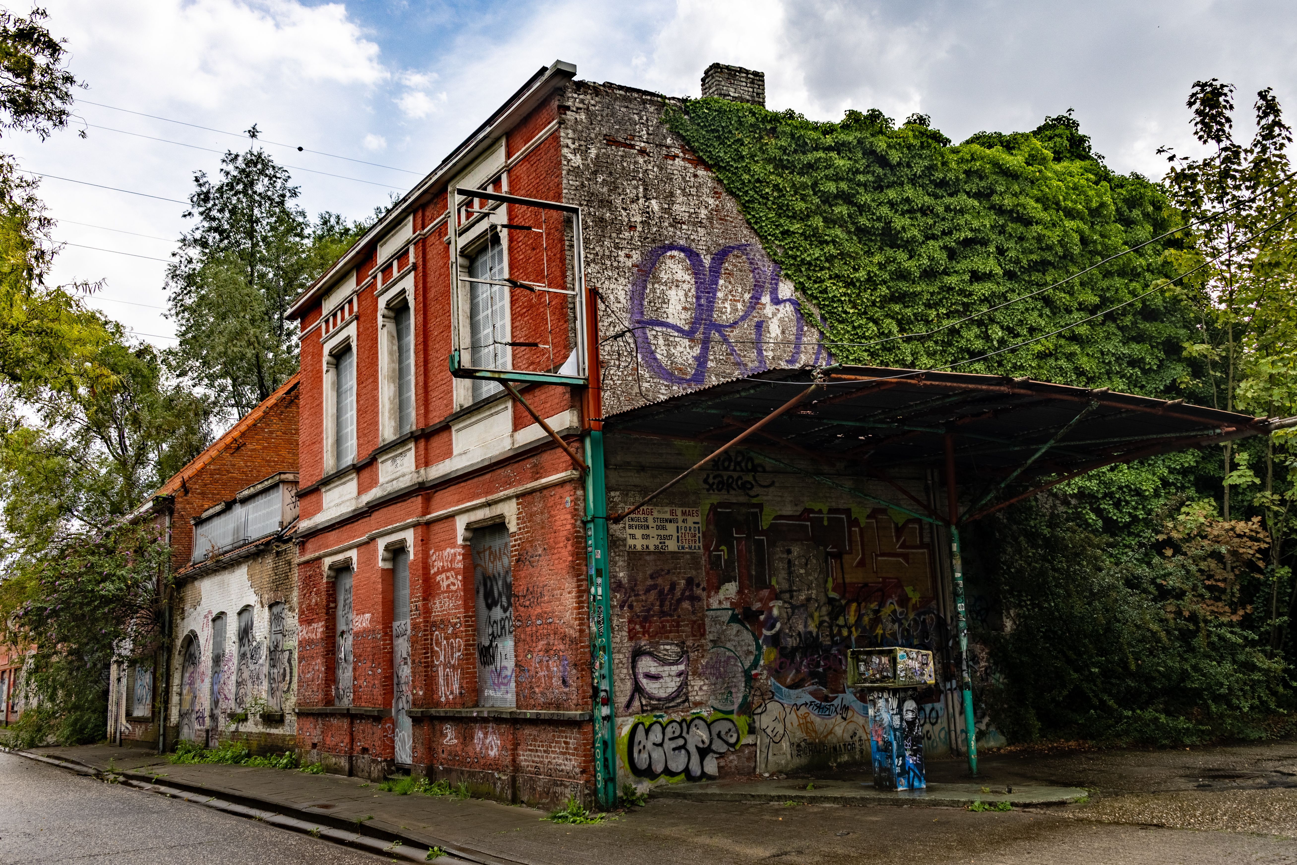 Abandoned Graffiti-Covered Brick Building · Free Stock Photo