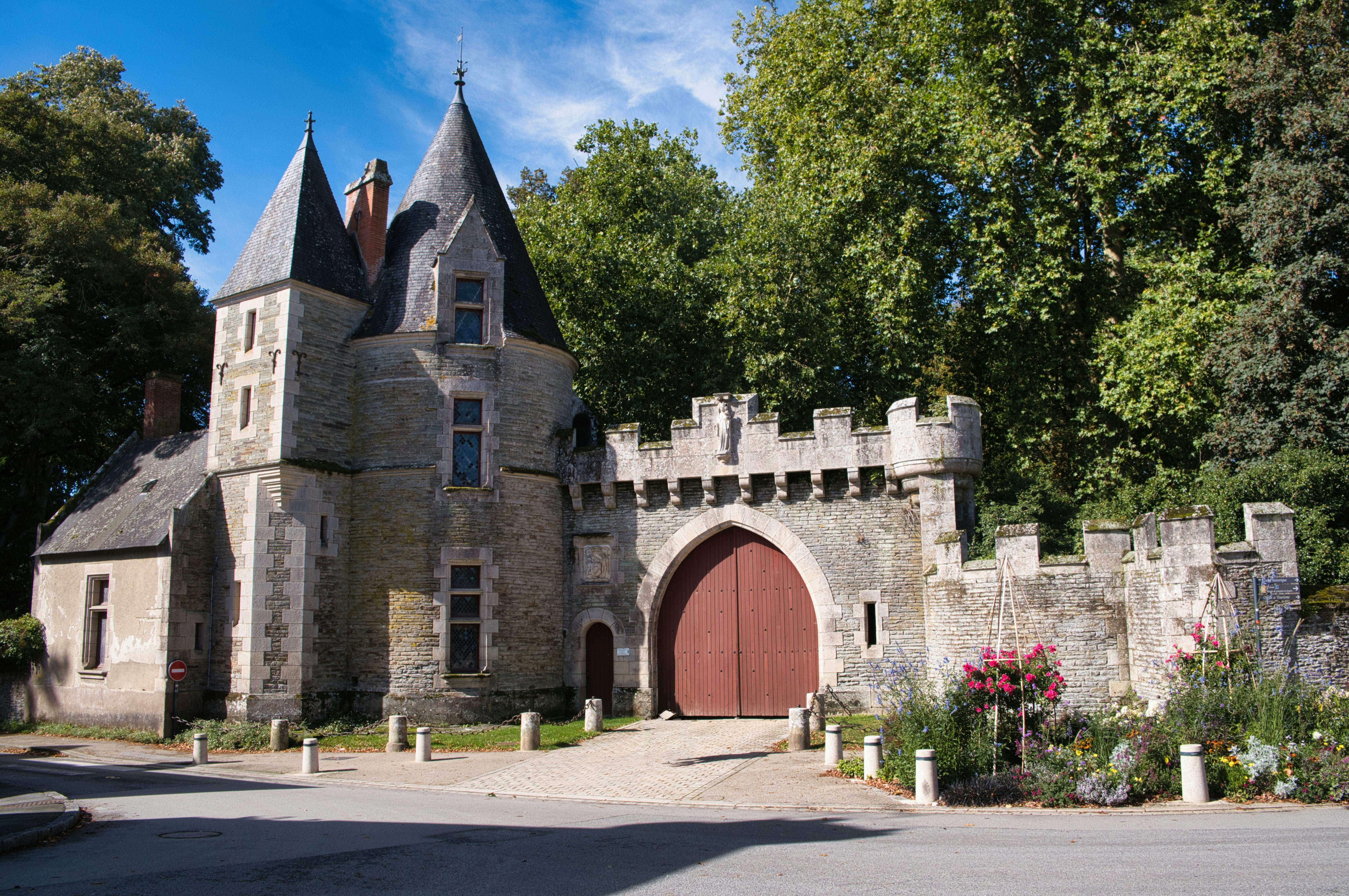Medieval Stone Castle with Turrets and Archway · Free Stock Photo