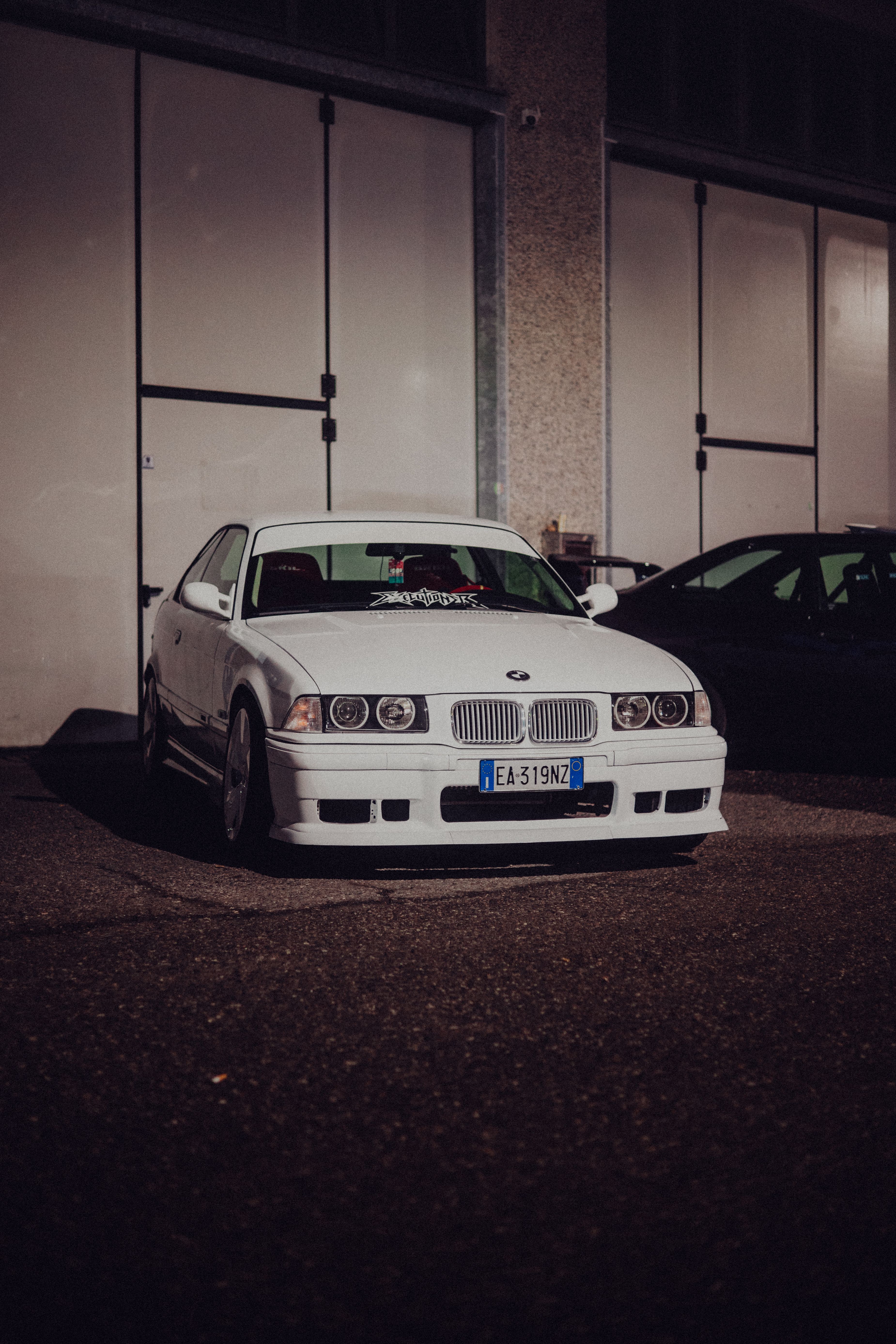 Classic White BMW Car Outside Garage · Free Stock Photo