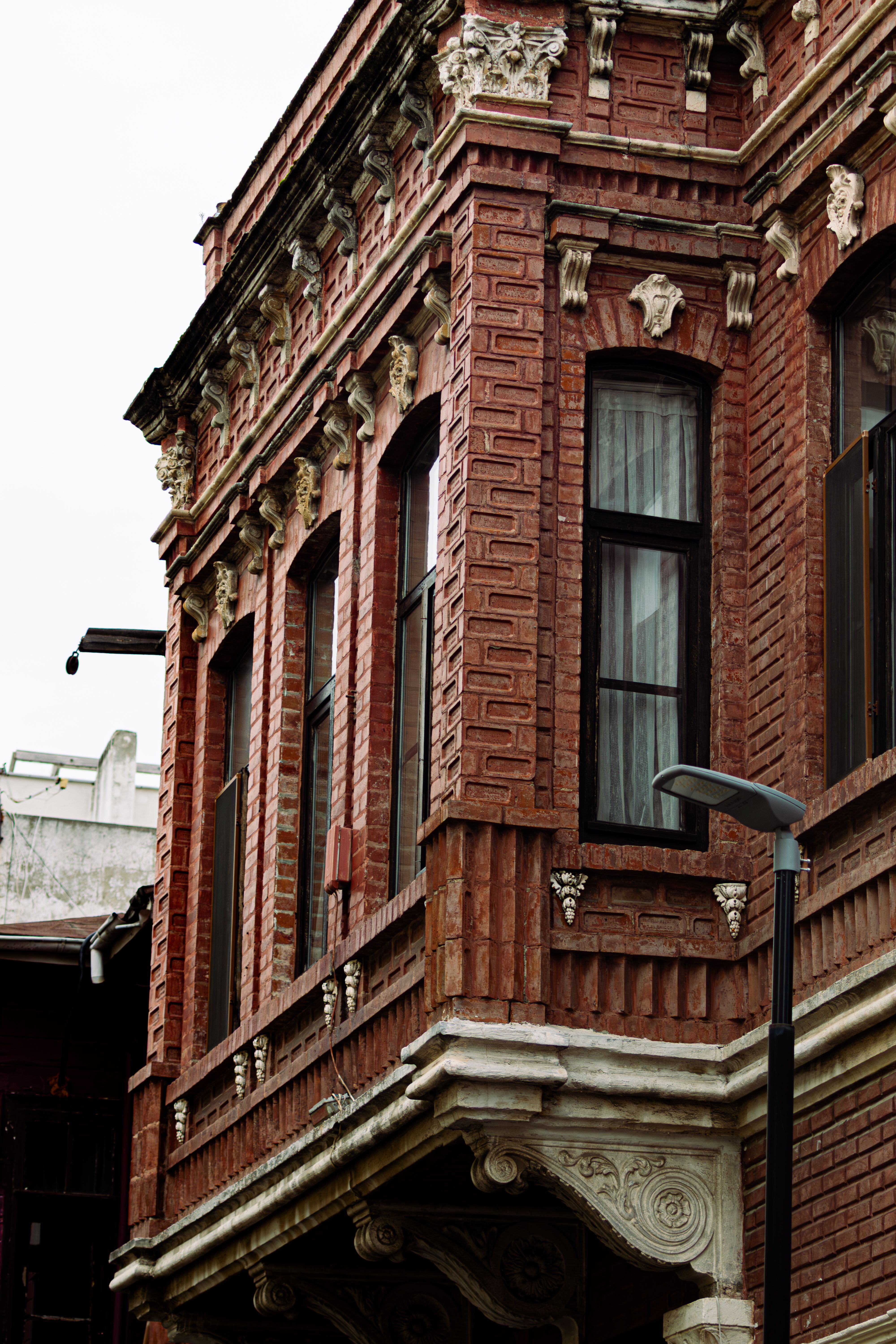 Historic Brick Architecture with Ornate Detailing · Free Stock Photo