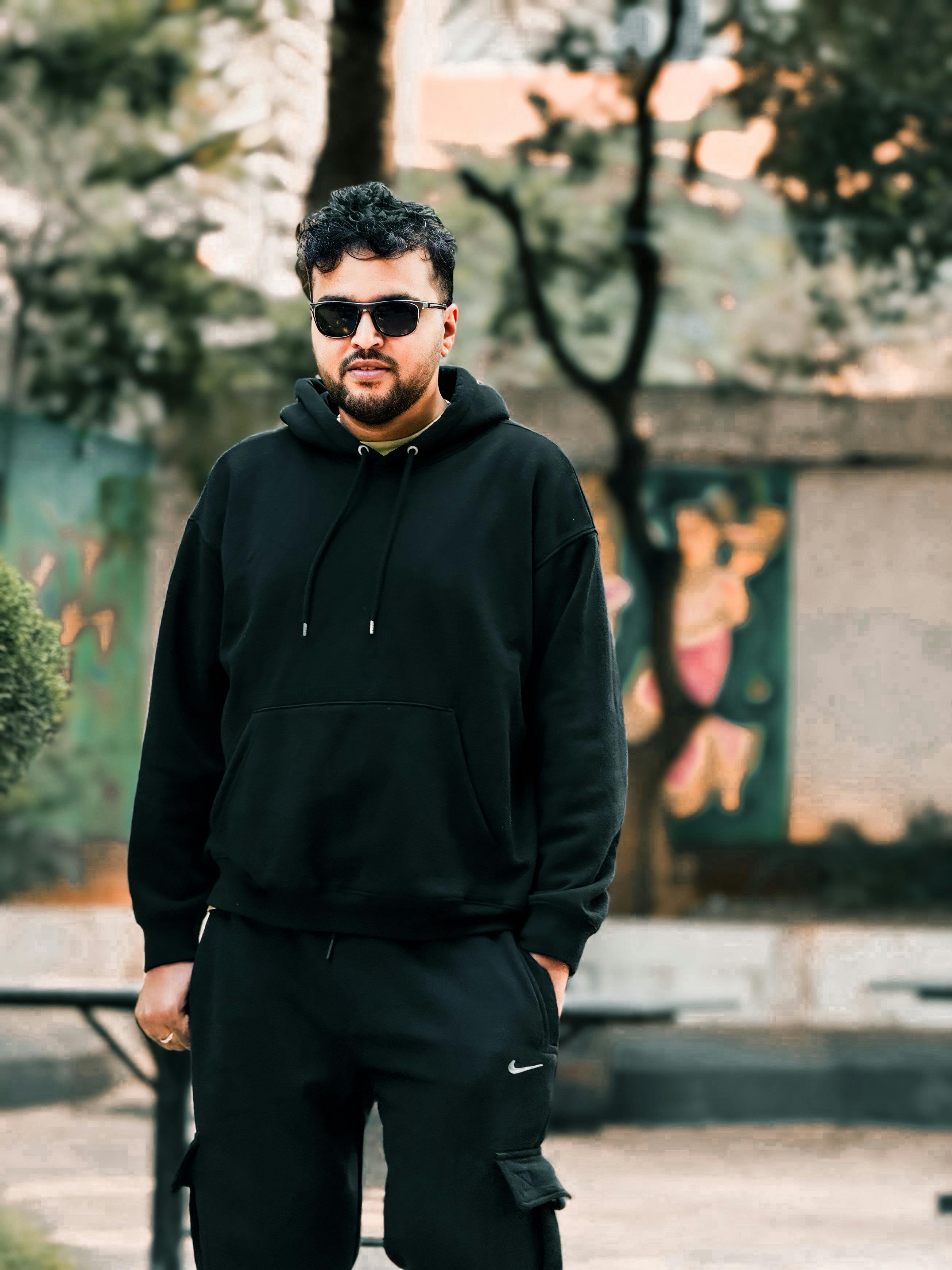 Stylish Man in Urban Park Setting · Free Stock Photo