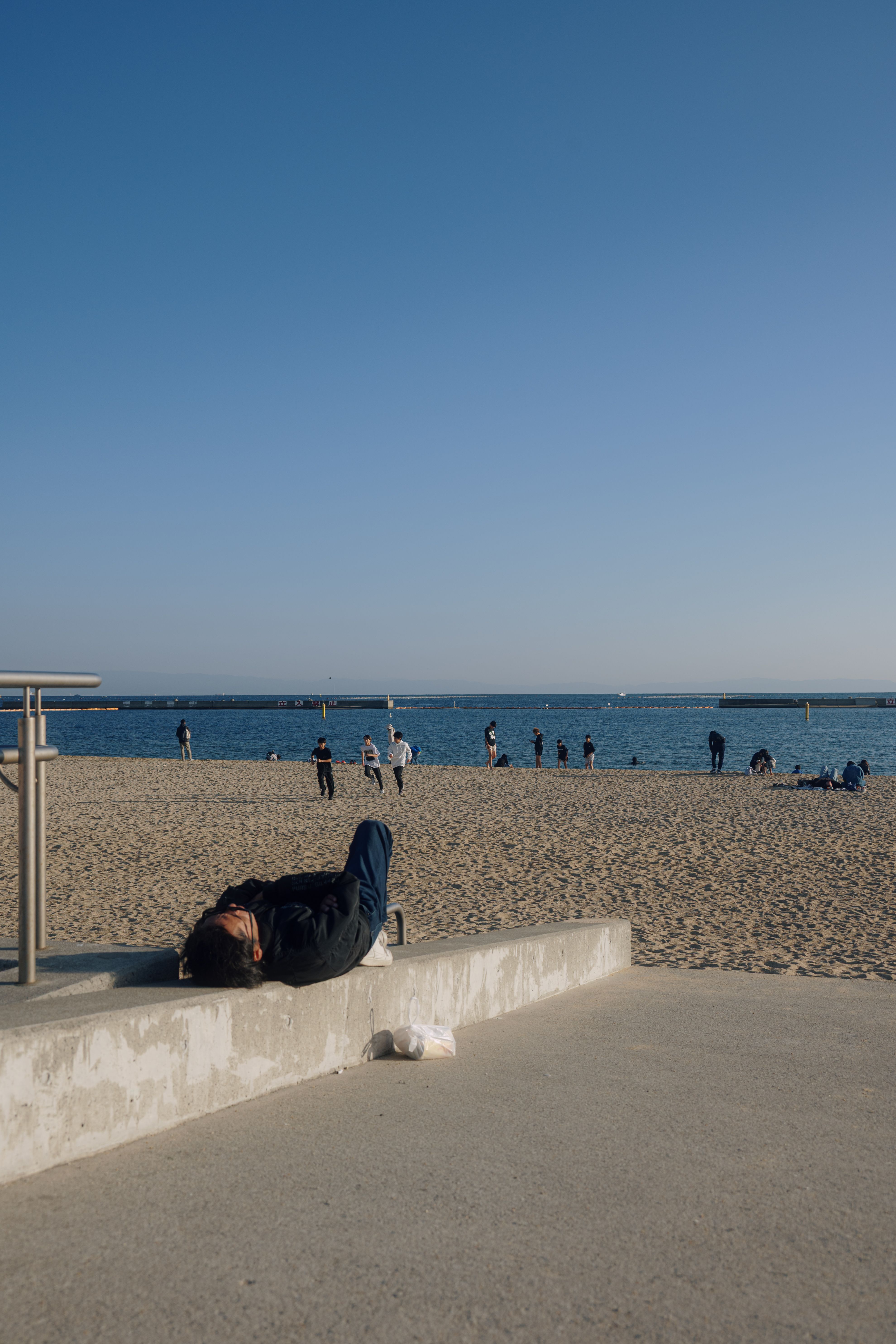 Relaxed Beach Day with Blue Sky and People · Free Stock Photo