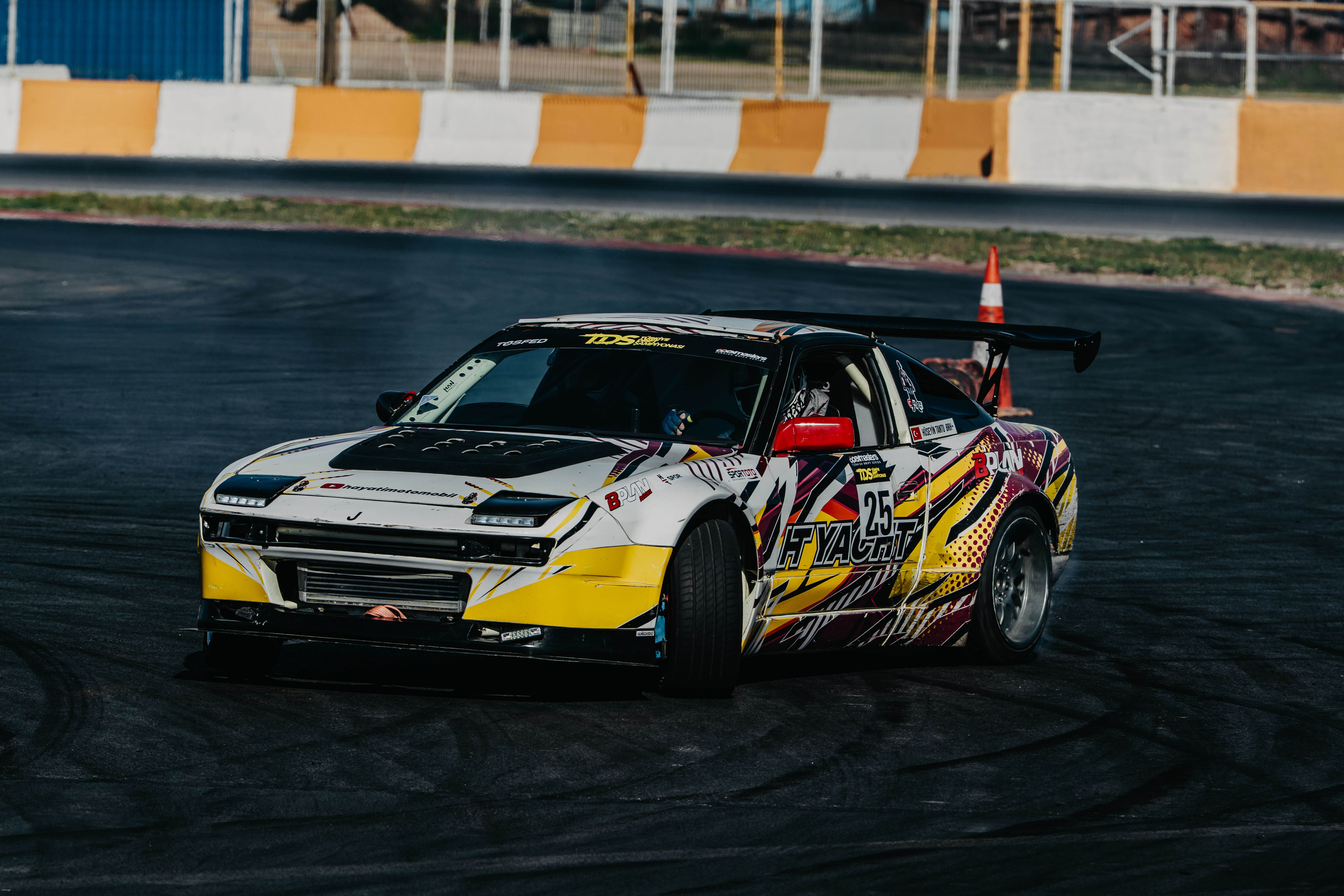 Vibrant Drift Racing Car on Track · Free Stock Photo
