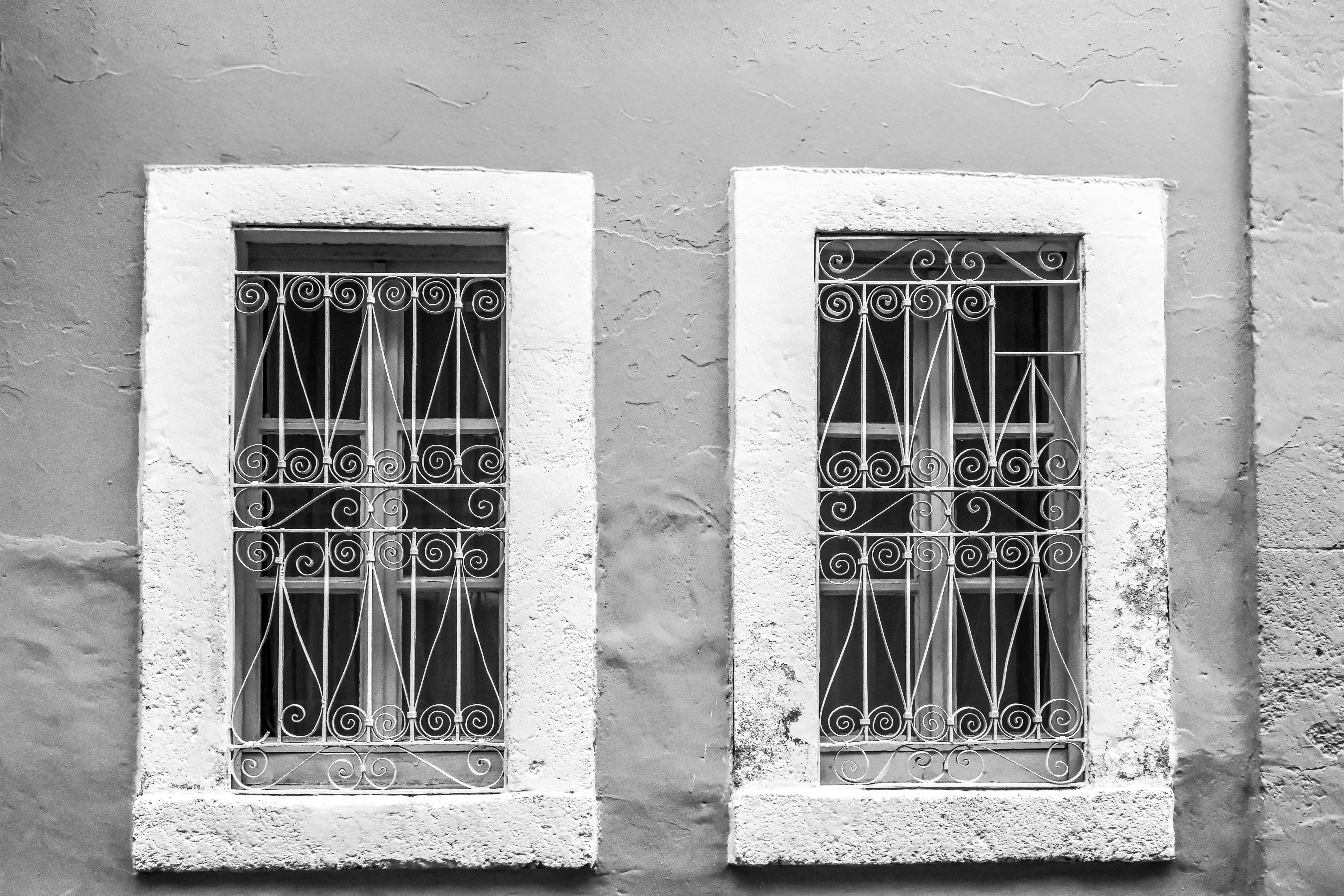 Black and White Photo of Two Grated Windows · Free Stock Photo