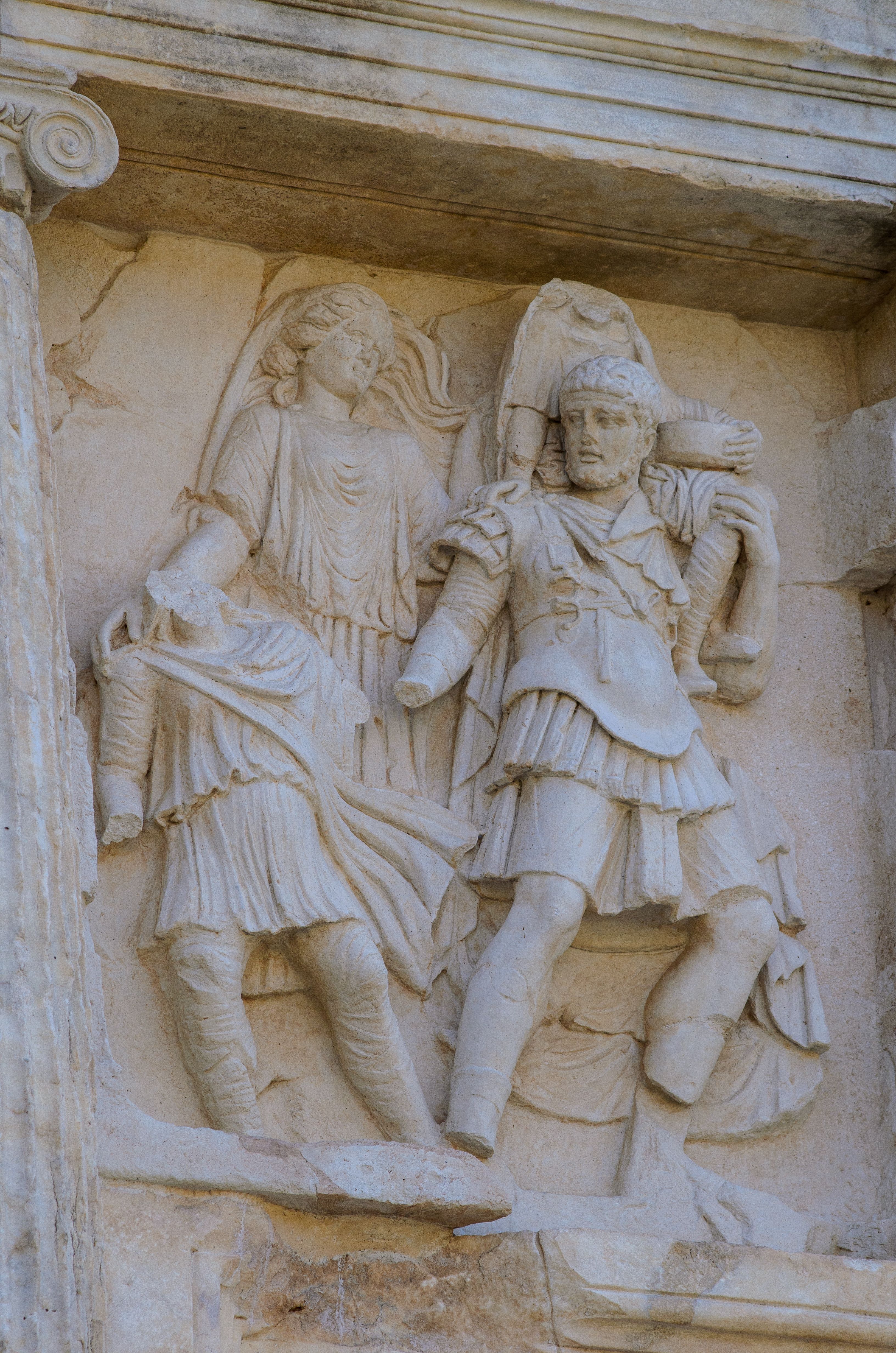 Ancient Roman Relief Sculpture on Marble Wall · Free Stock Photo