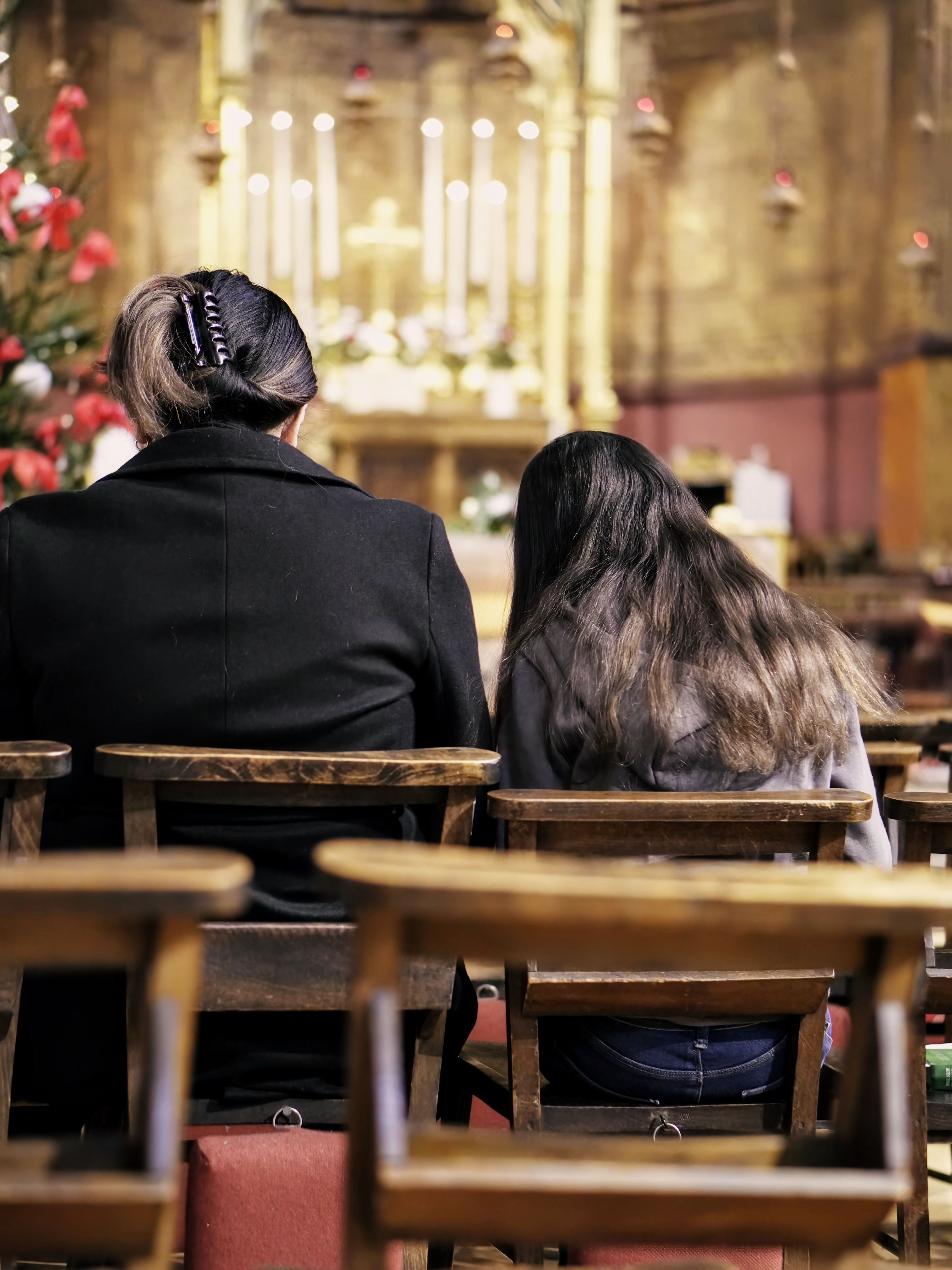 Two People Sitting in English Church Interior · Free Stock Photo