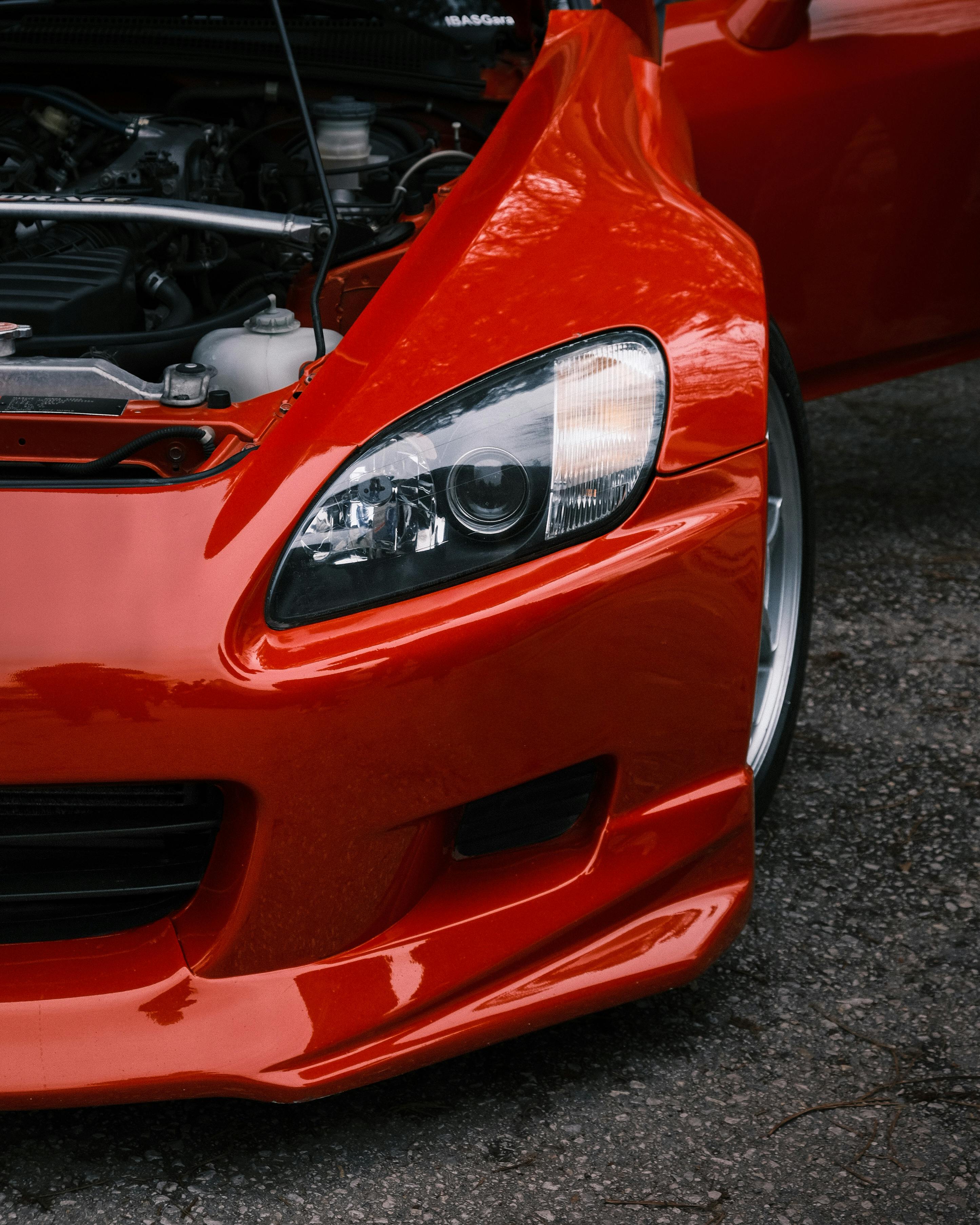 Close-up of Sporty Red Car with Open Hood · Free Stock Photo
