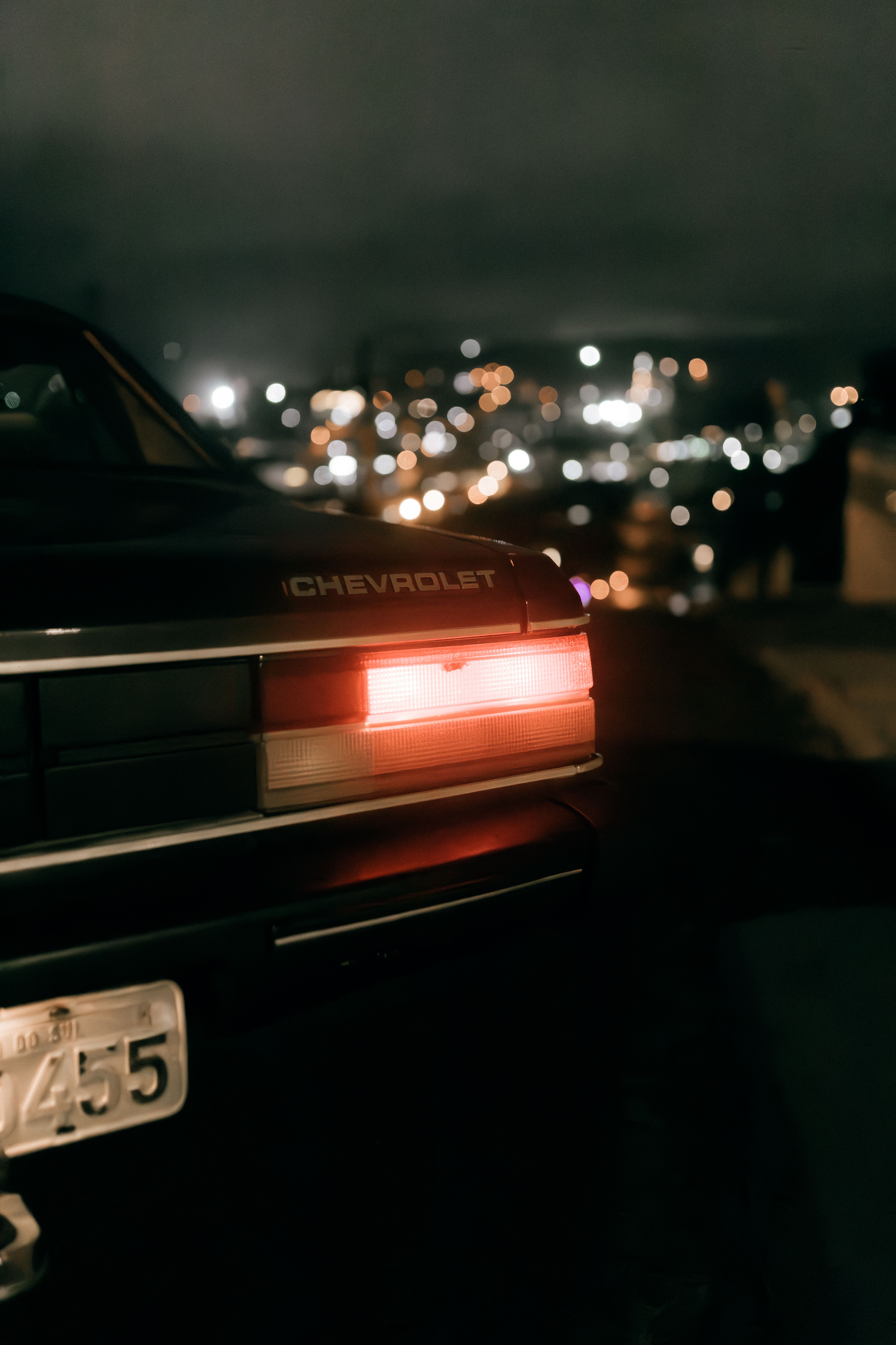 Classic Chevrolet Car at Night in Cityscape · Free Stock Photo