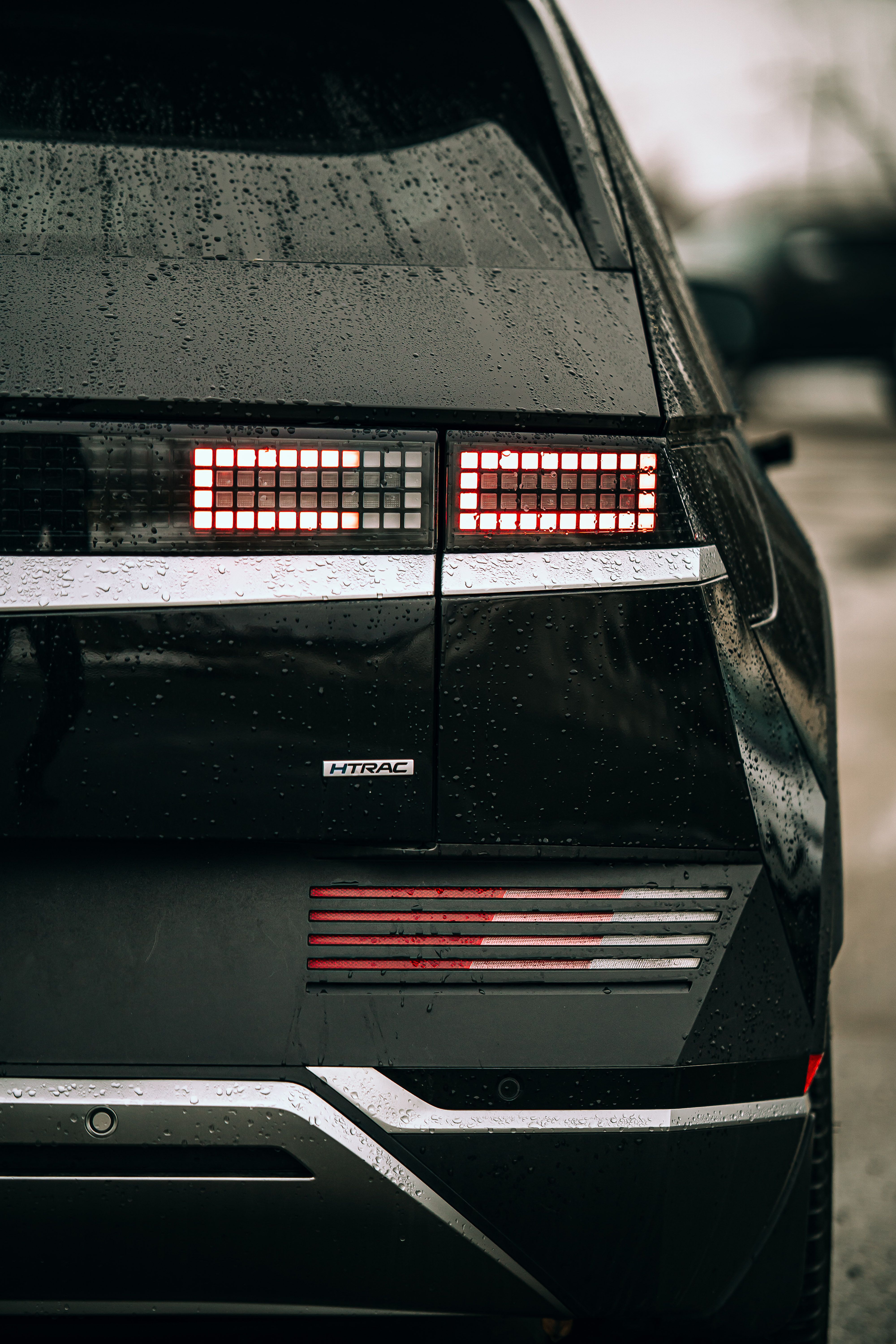 Close-Up of Modern Electric Car Tail Light Design · Free Stock Photo