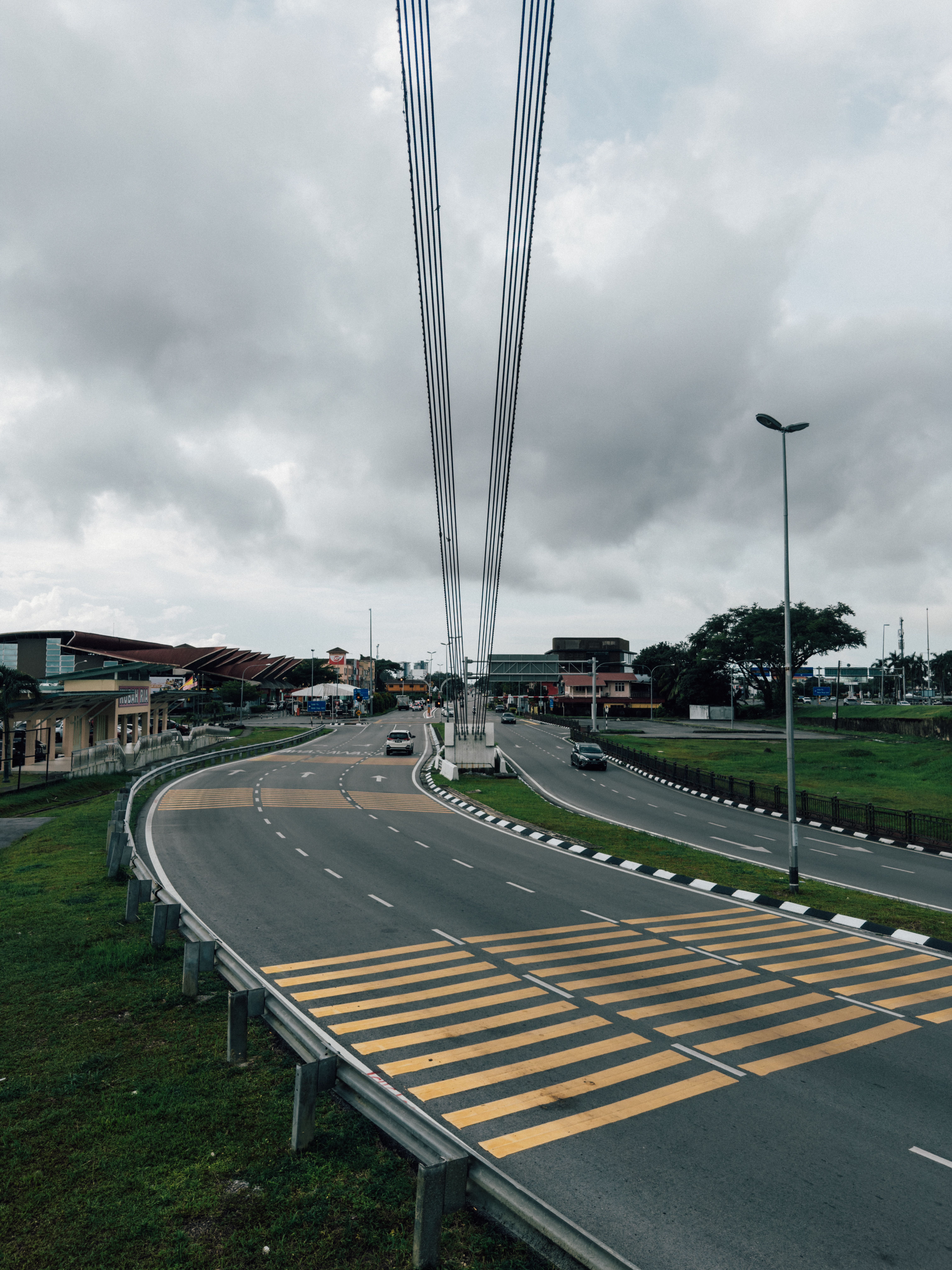 Aerial View of Urban Road and Overcast Sky · Free Stock Photo