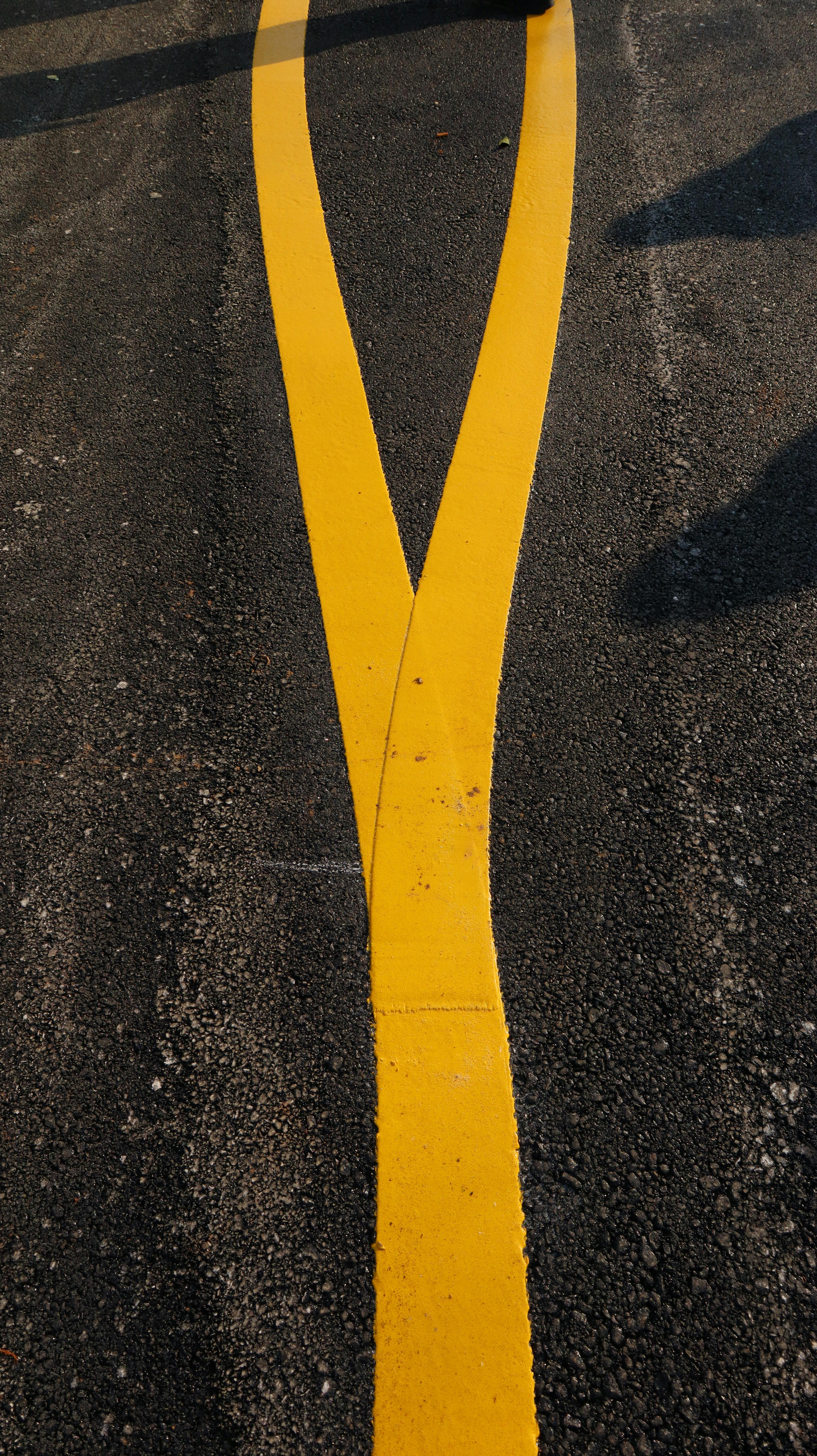 Yellow Road Line on Asphalt Surface · Free Stock Photo
