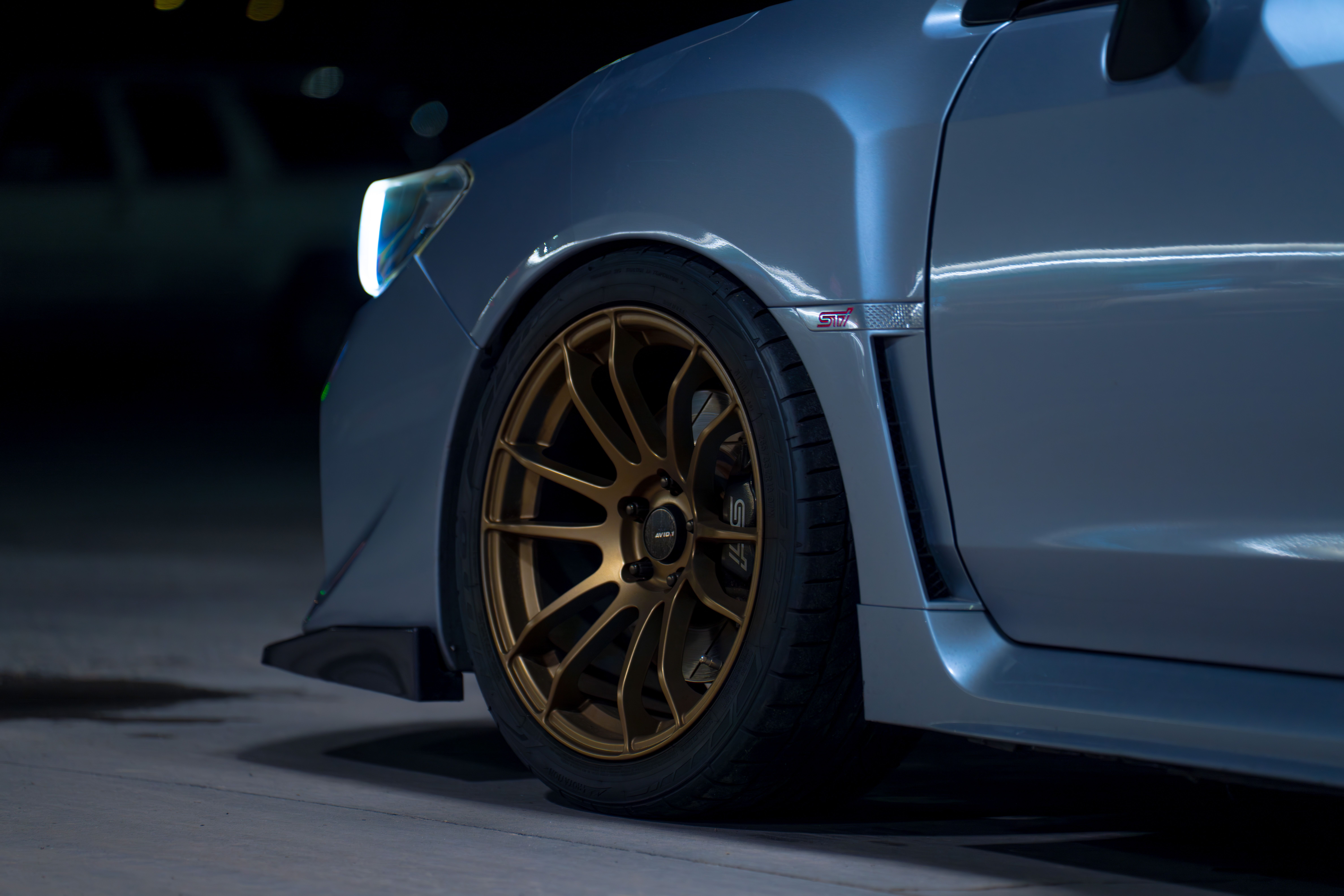 Blue Subaru STI with Gold Rims at Night · Free Stock Photo
