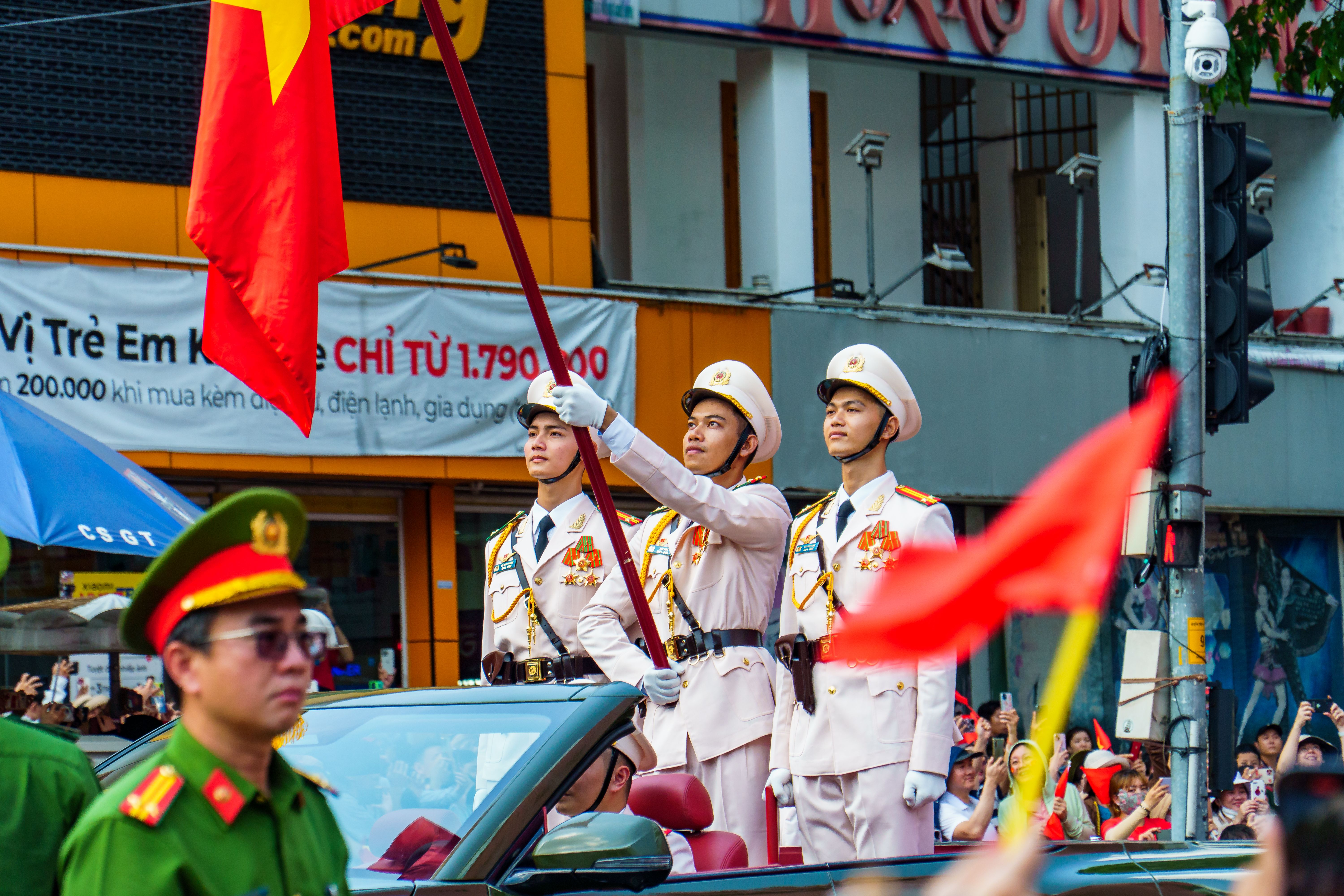 Vietnamese Soldiers in Parade Holding National Flag · Free Stock Photo