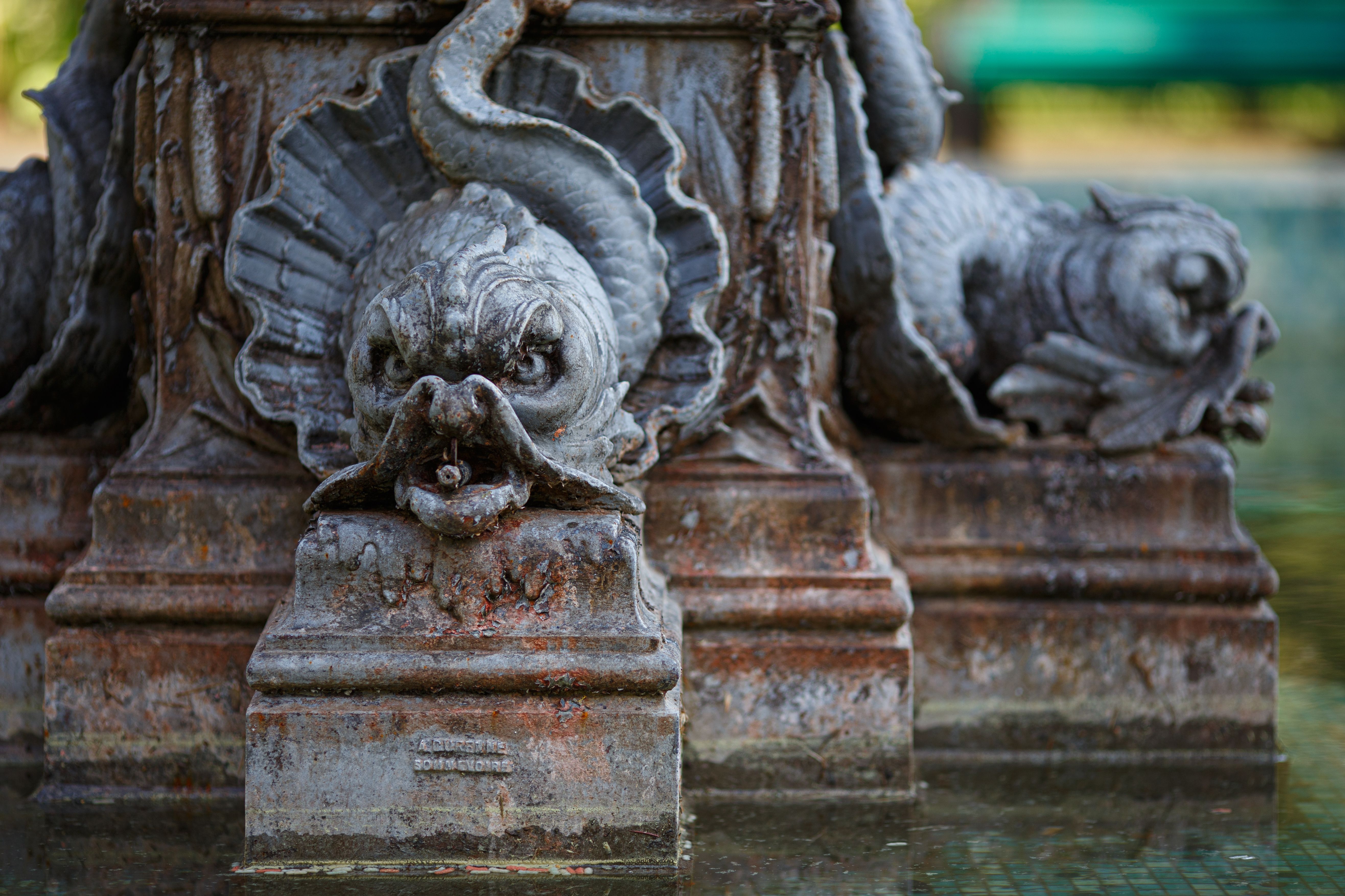 Intricate stone fountain with aquatic sculptures · Free Stock Photo