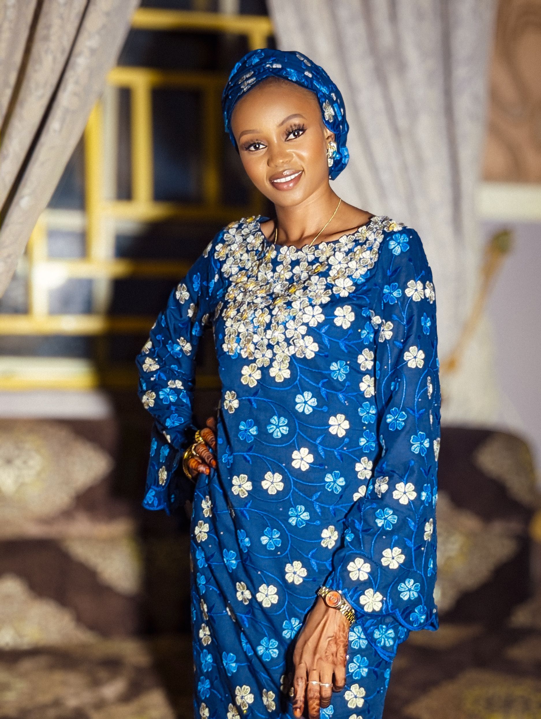 Elegant Woman in Traditional Blue Attire Indoors · Free Stock Photo
