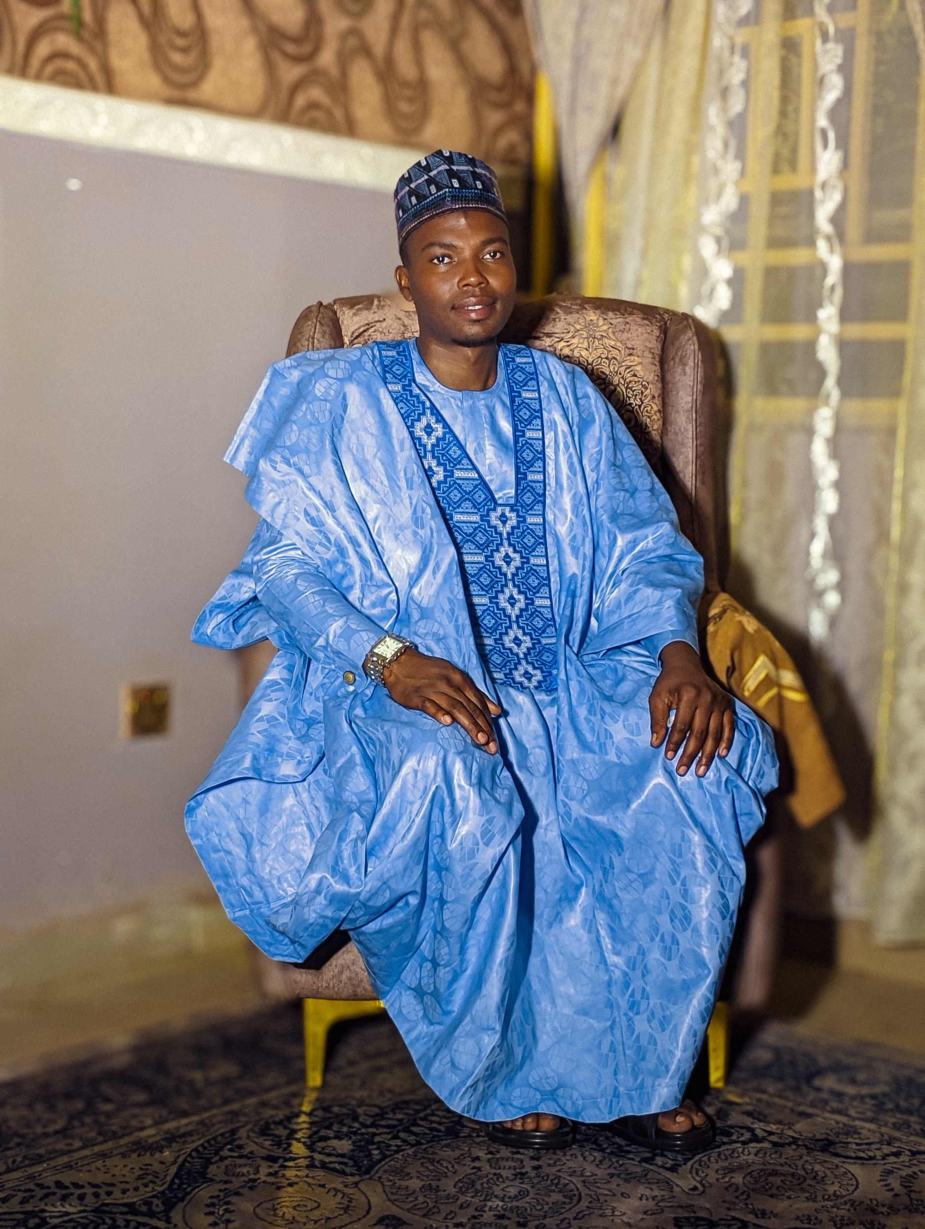 Elegant Hausa Man in Traditional Attire Indoors · Free Stock Photo