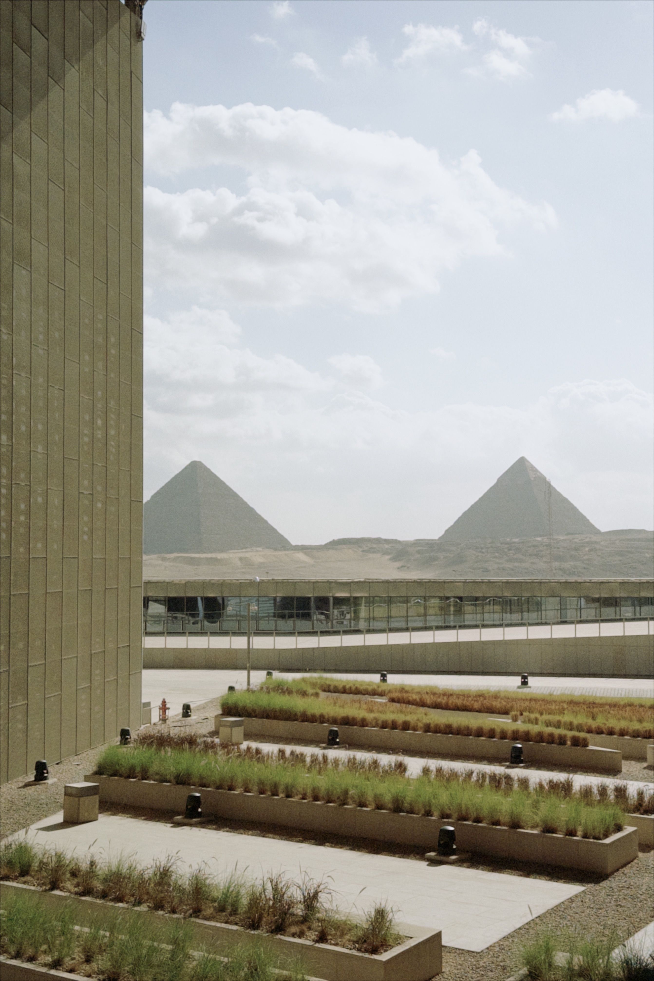 Modern Architecture with Pyramids in Background · Free Stock Photo