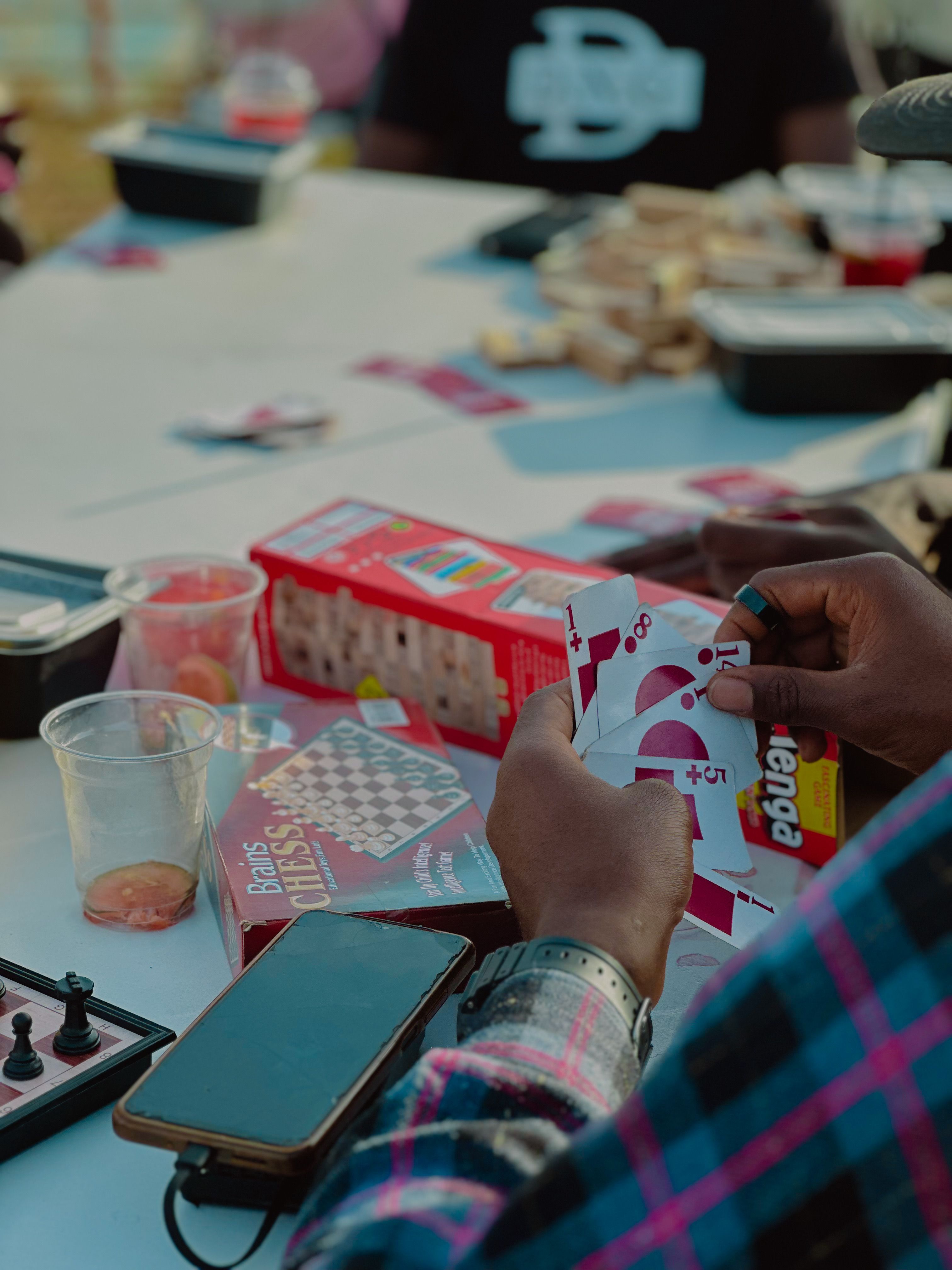Group Enjoying Outdoor Tabletop Games Gathering · Free Stock Photo