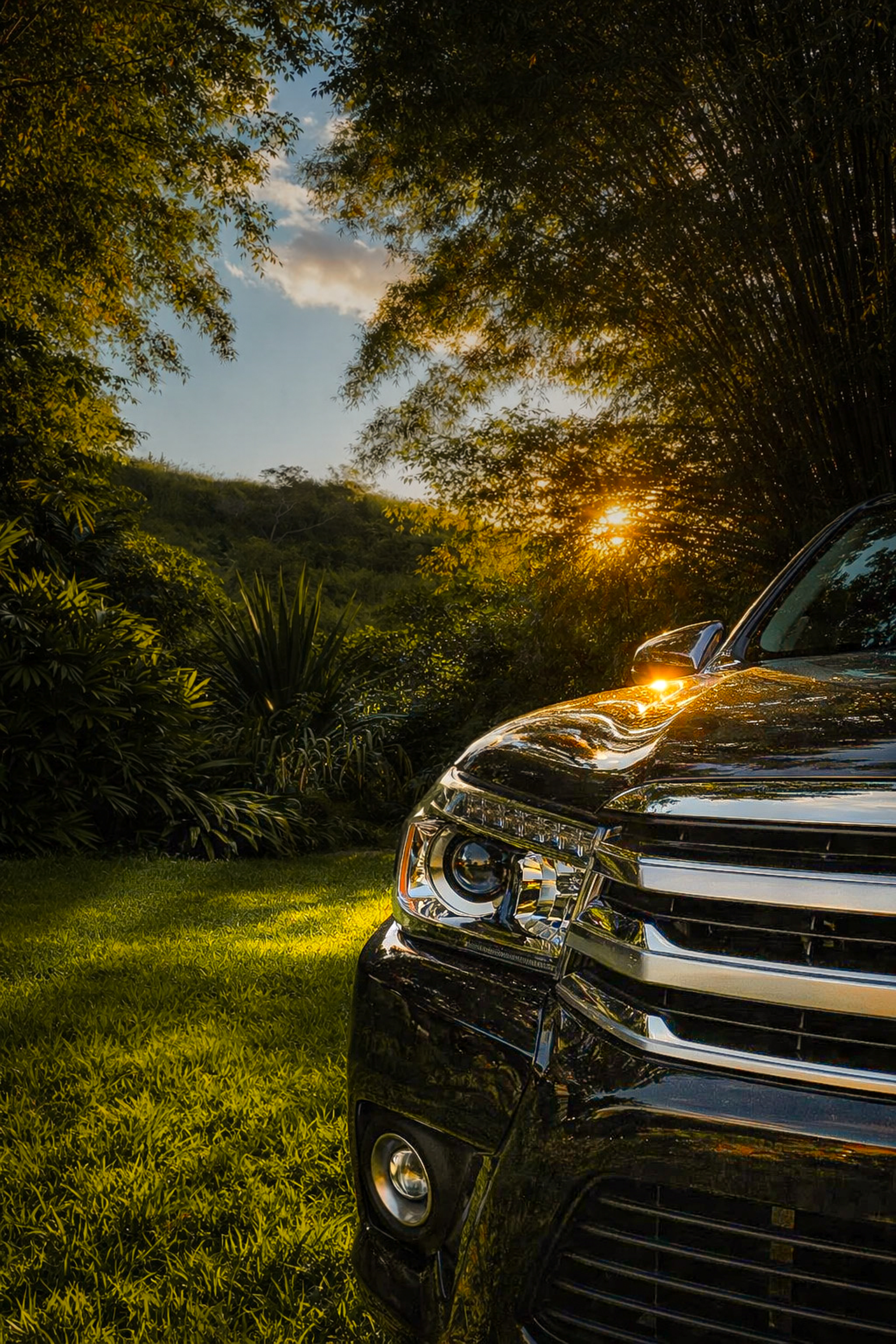Luxurious Car in Scenic Sunset Landscape · Free Stock Photo