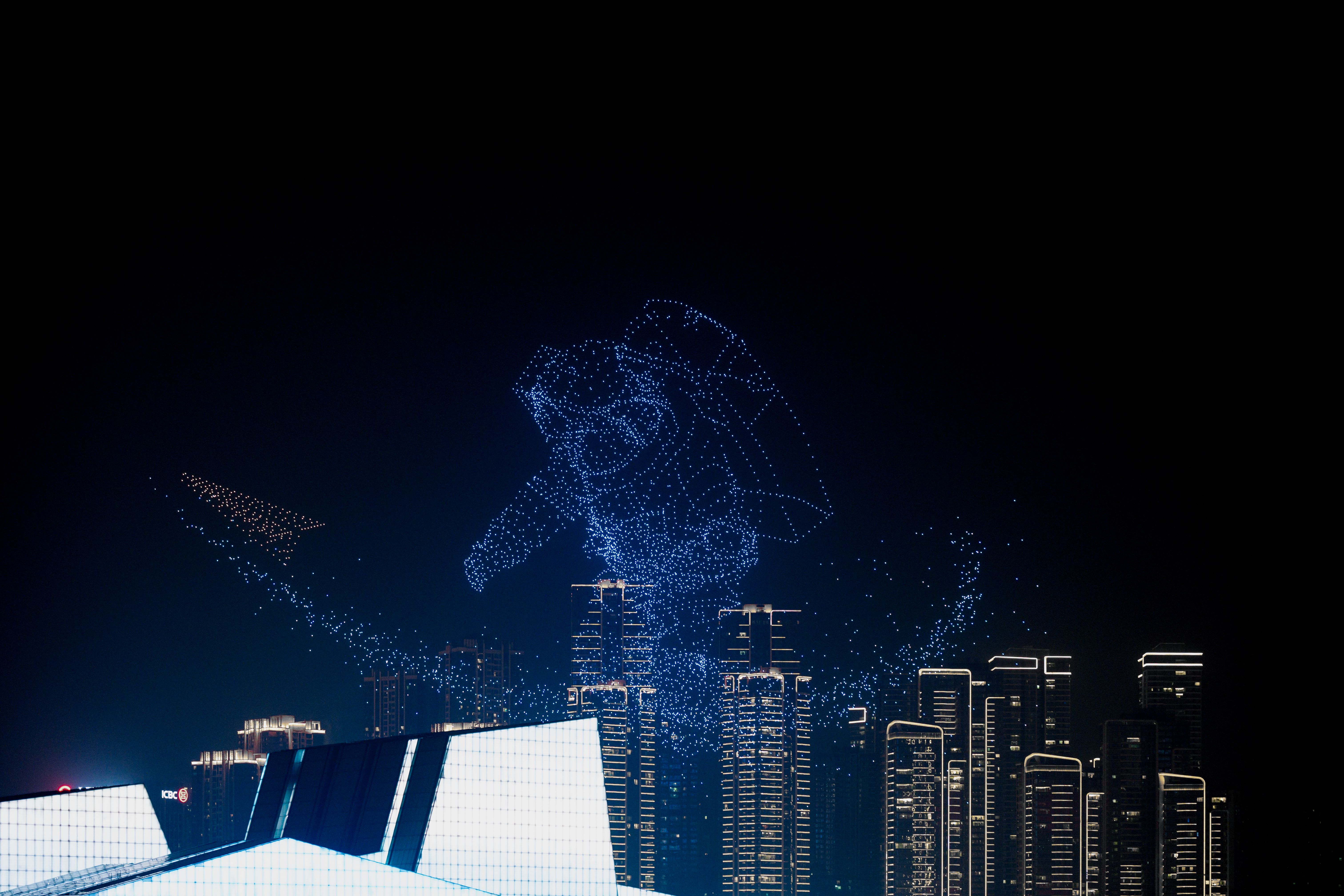 Drone Light Show Over City Skyline at Night · Free Stock Photo