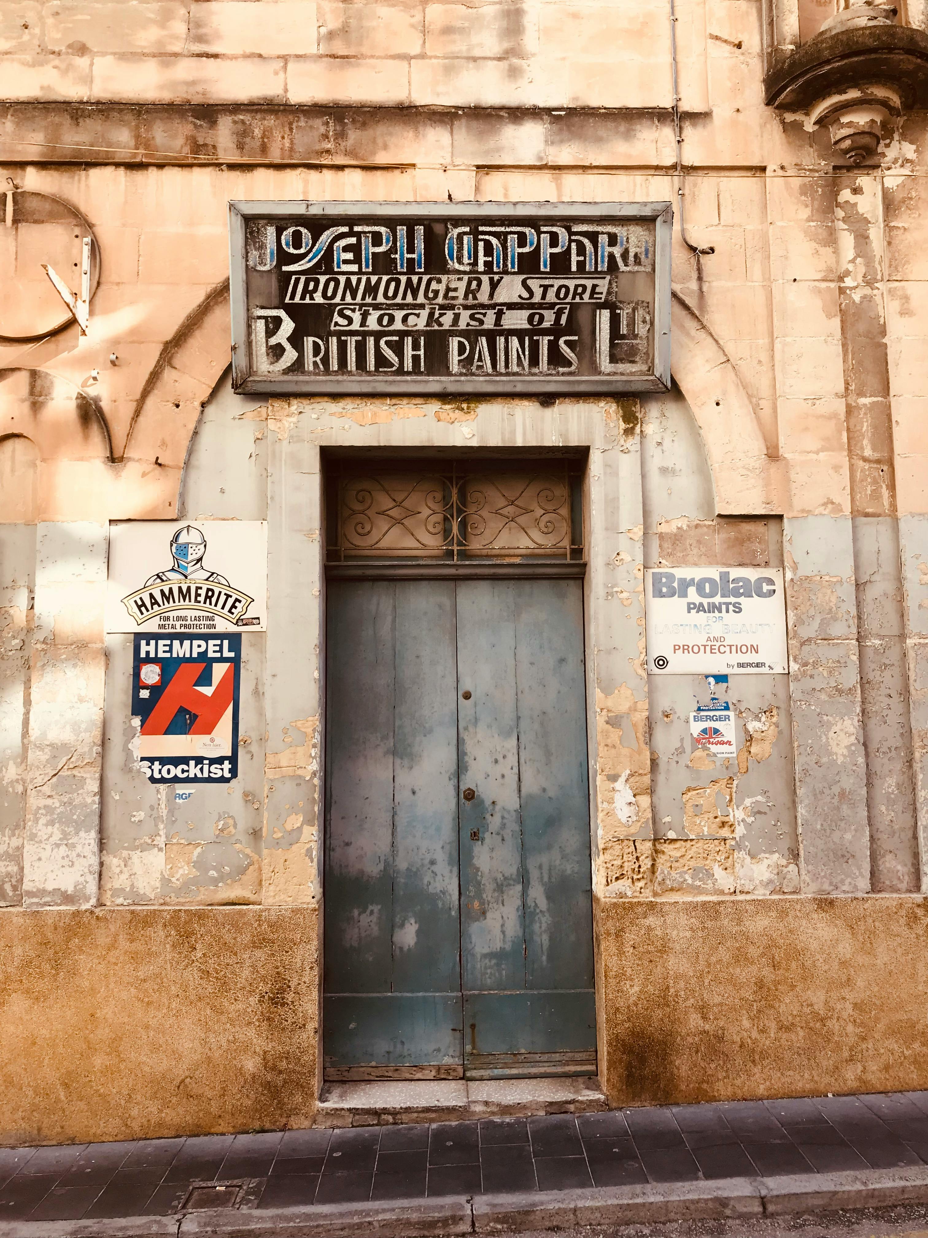 Historic Ironmongery Storefront with Vintage Signs · Free Stock Photo