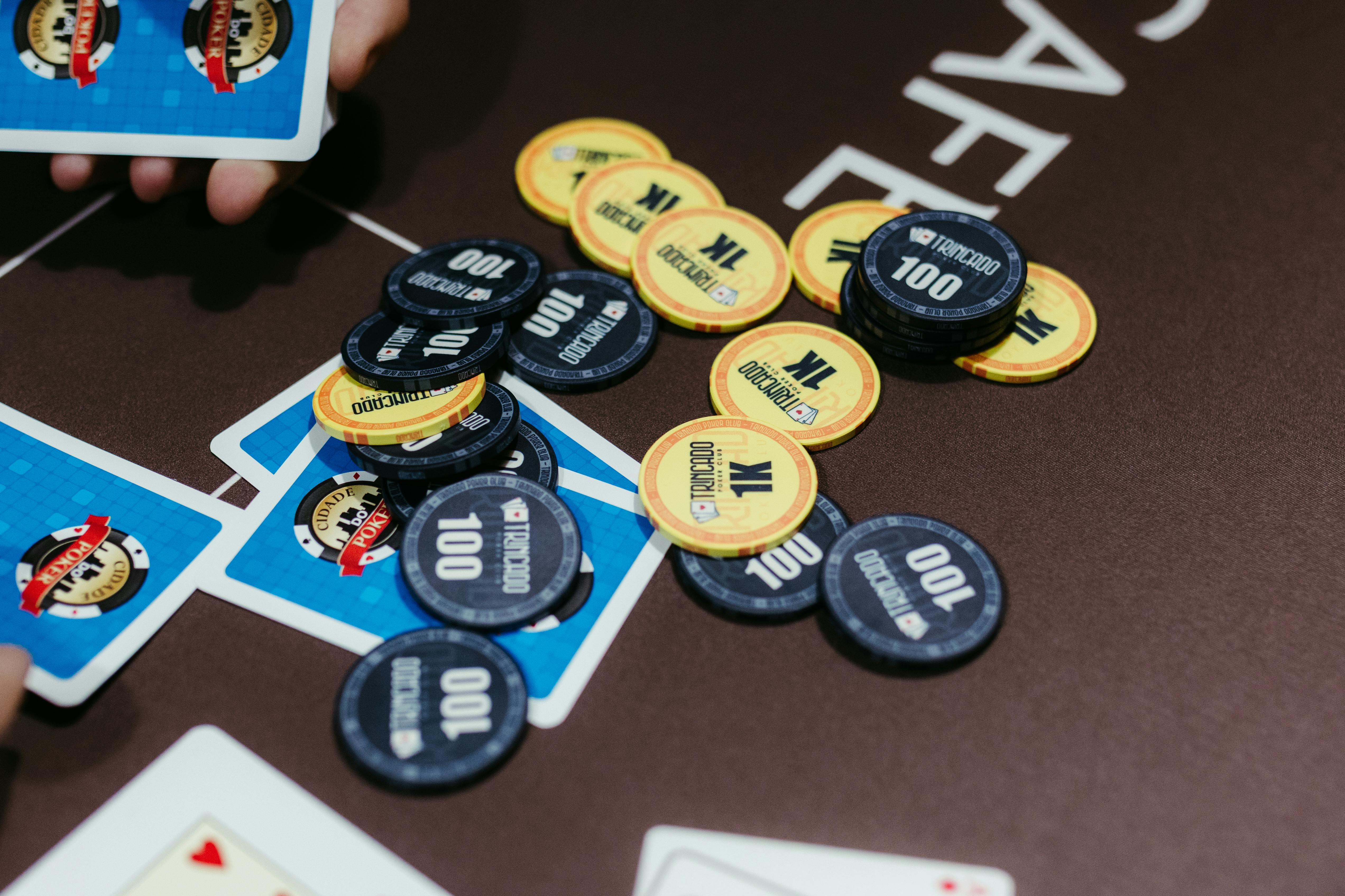 Texas Hold'em Poker Chips and Cards in Play · Free Stock Photo