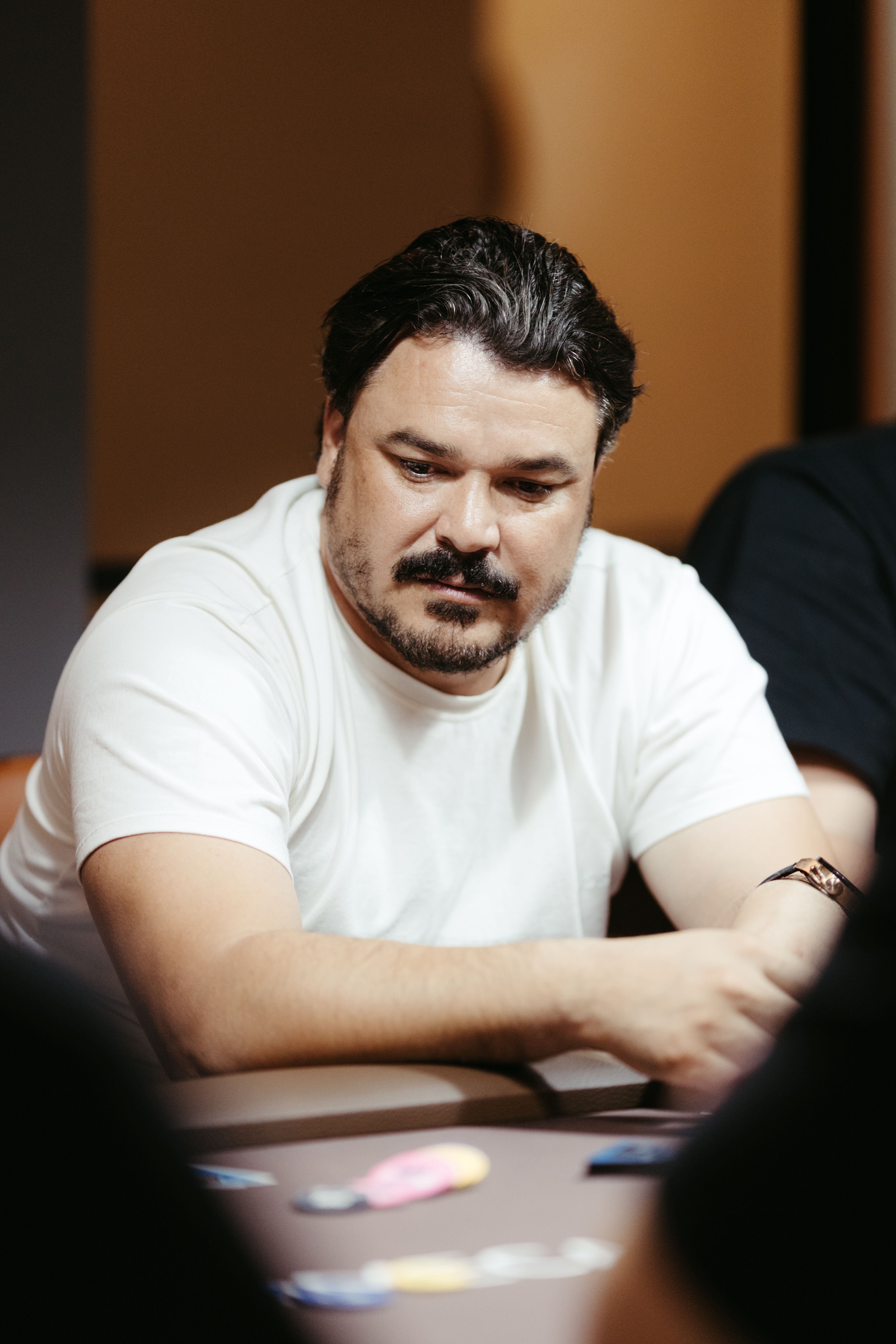 Intense Poker Game with Focused Player · Free Stock Photo
