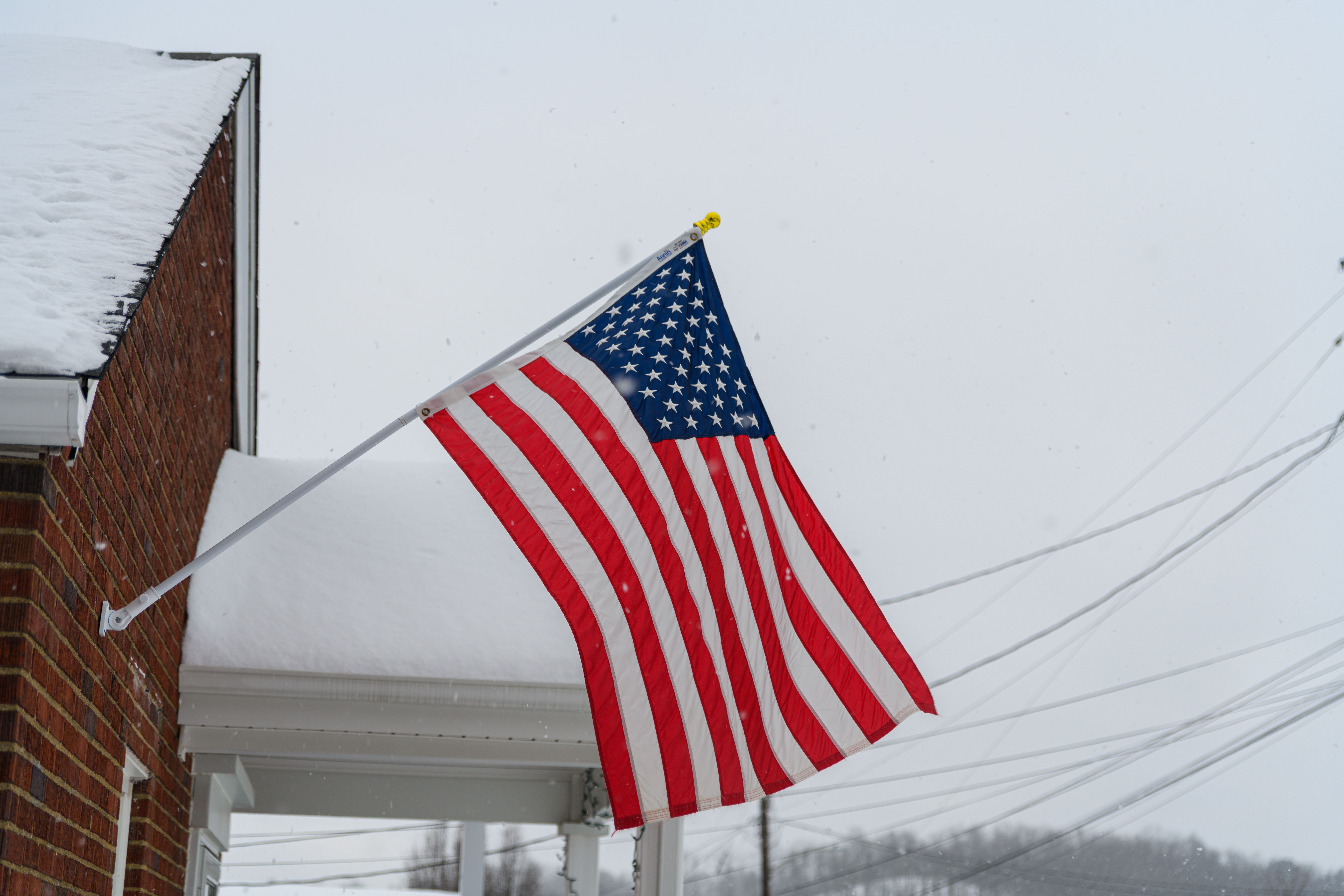 American Flag Waving in Snowy Canonsburg · Free Stock Photo