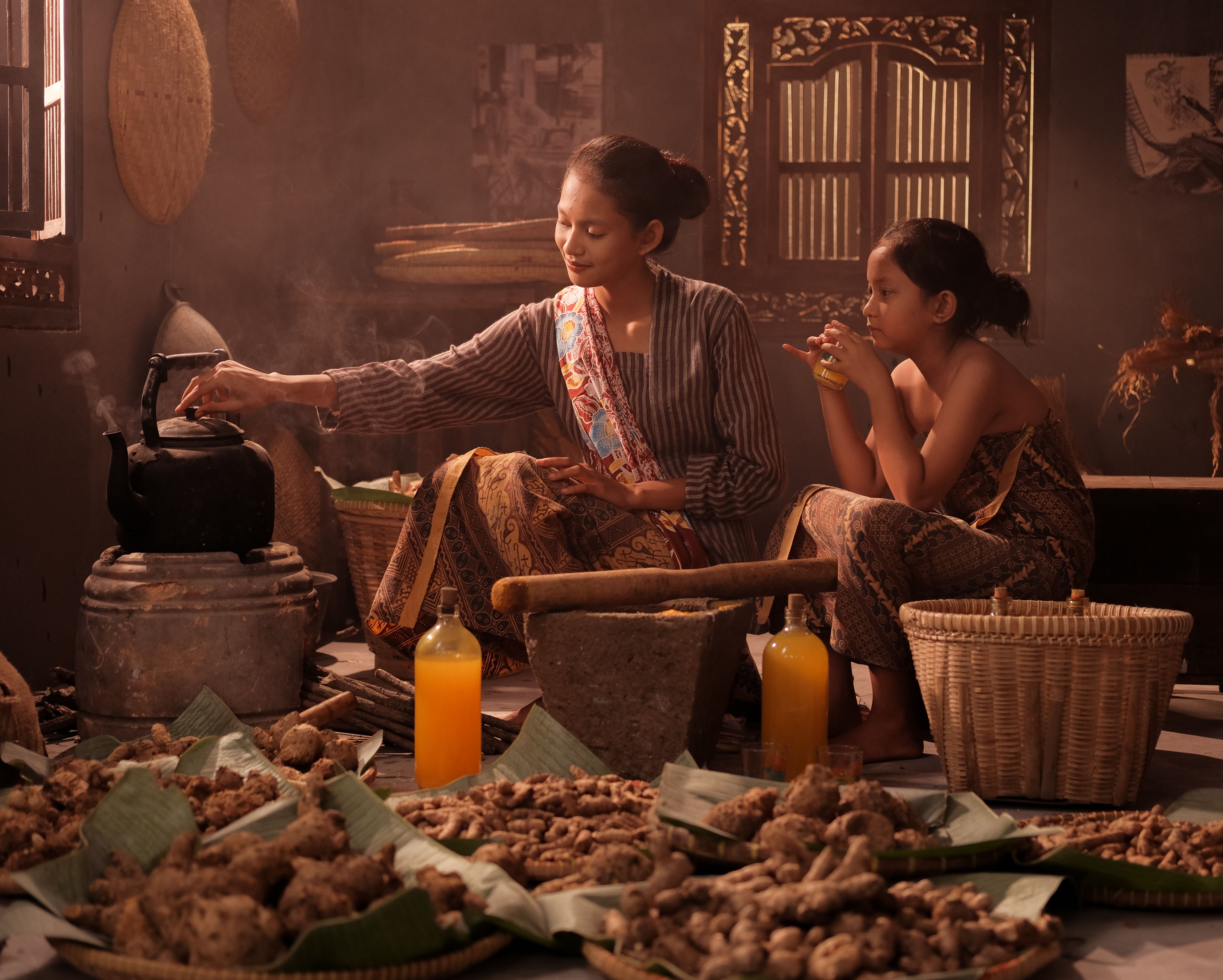 Traditional Indonesian Kitchen Scene with Family · Free Stock Photo