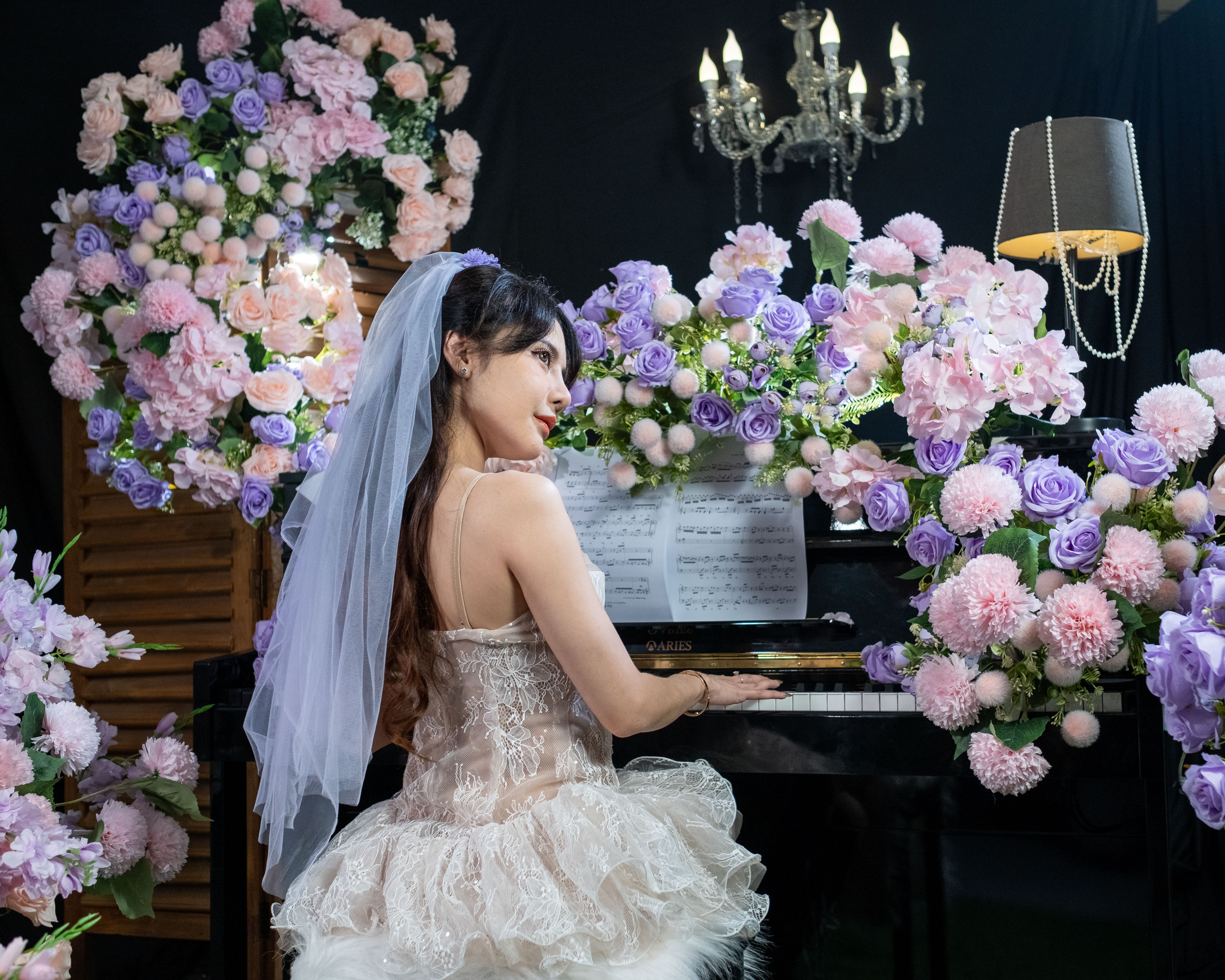 Bride Playing Piano Surrounded by Flowers · Free Stock Photo