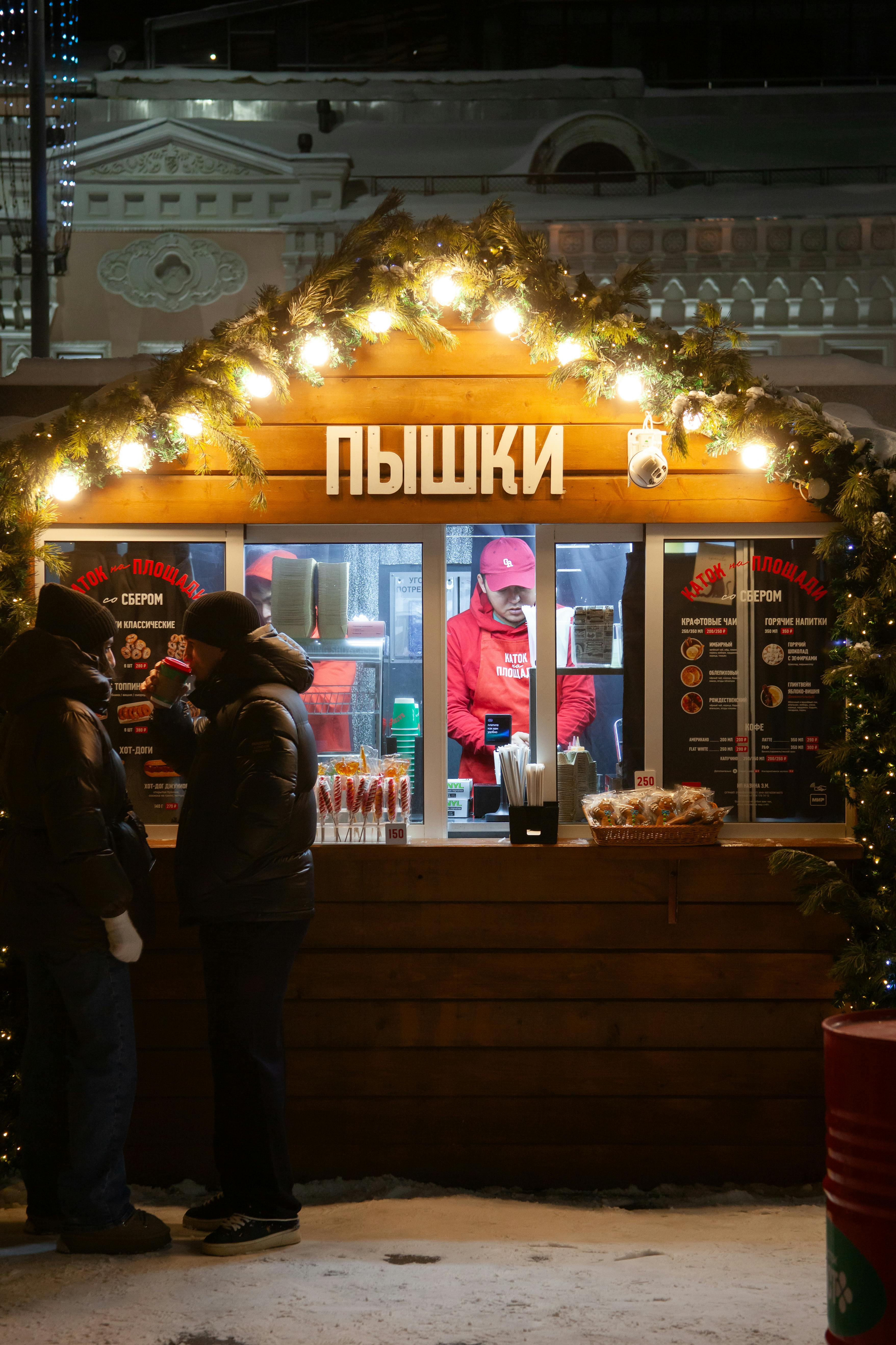 Cozy Winter Night Market Donut Stall · Free Stock Photo