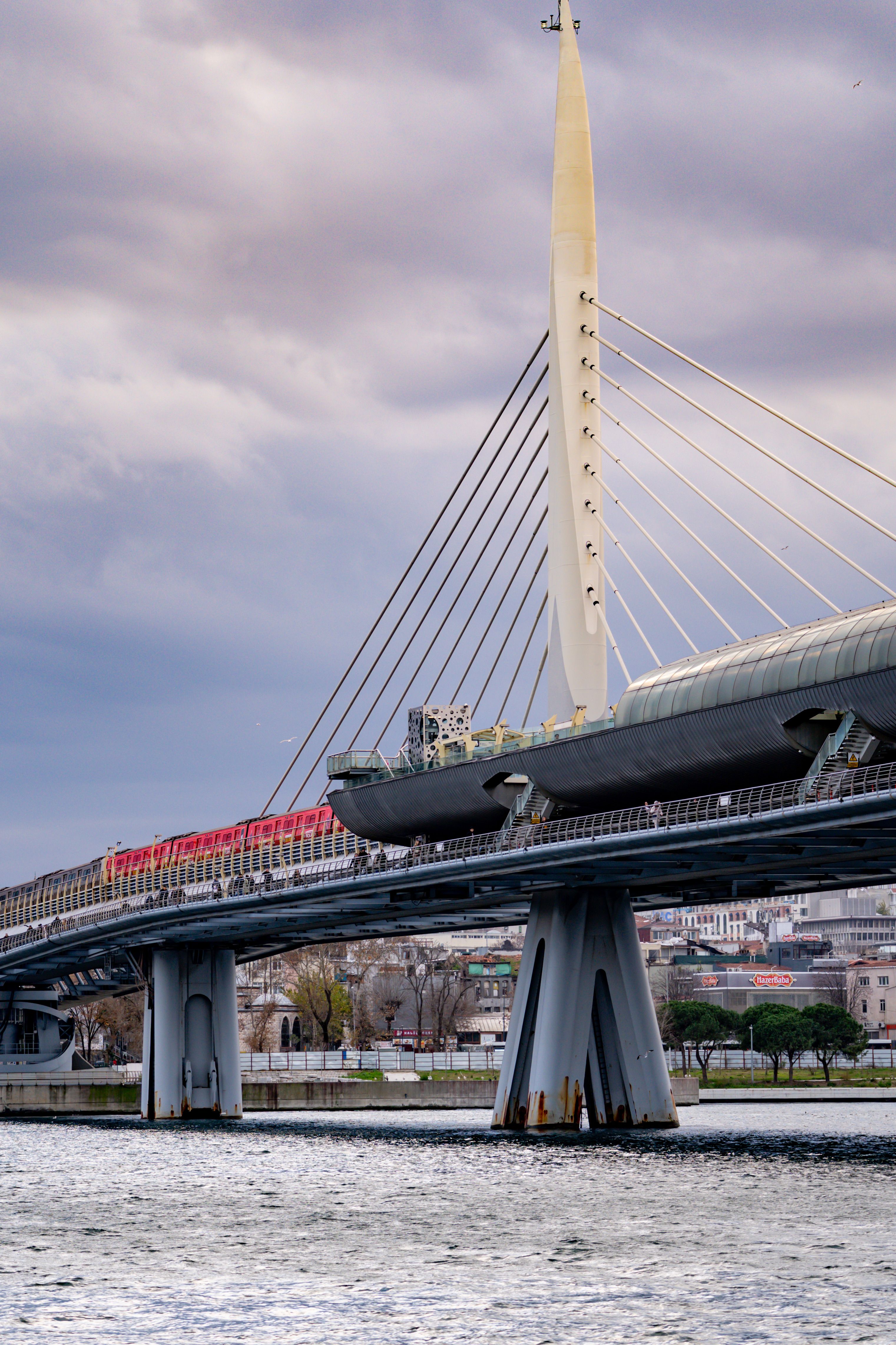 Elegant Modern Bridge Spanning Calm River · Free Stock Photo
