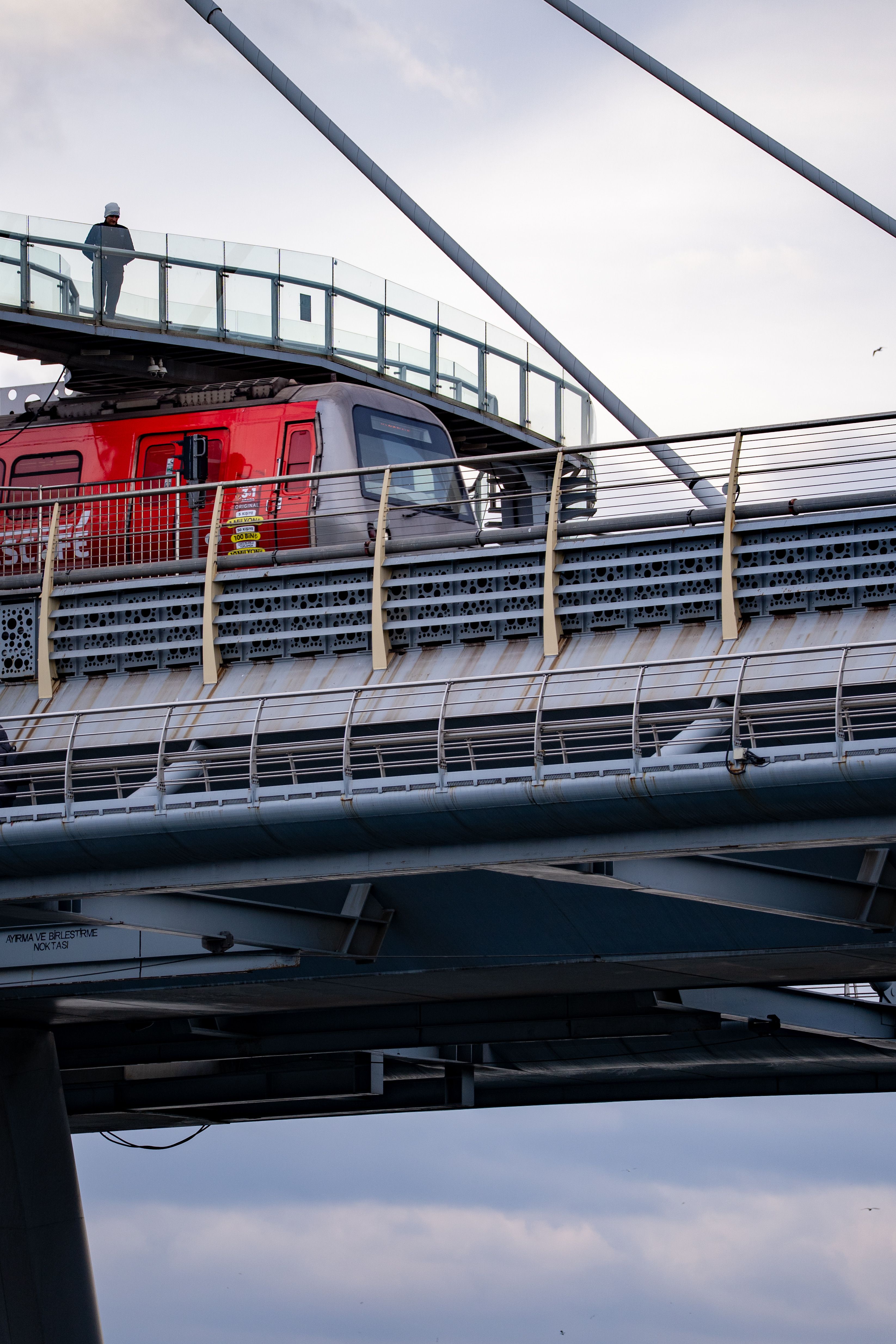 Modern Train Crossing Urban Bridge in Daylight · Free Stock Photo