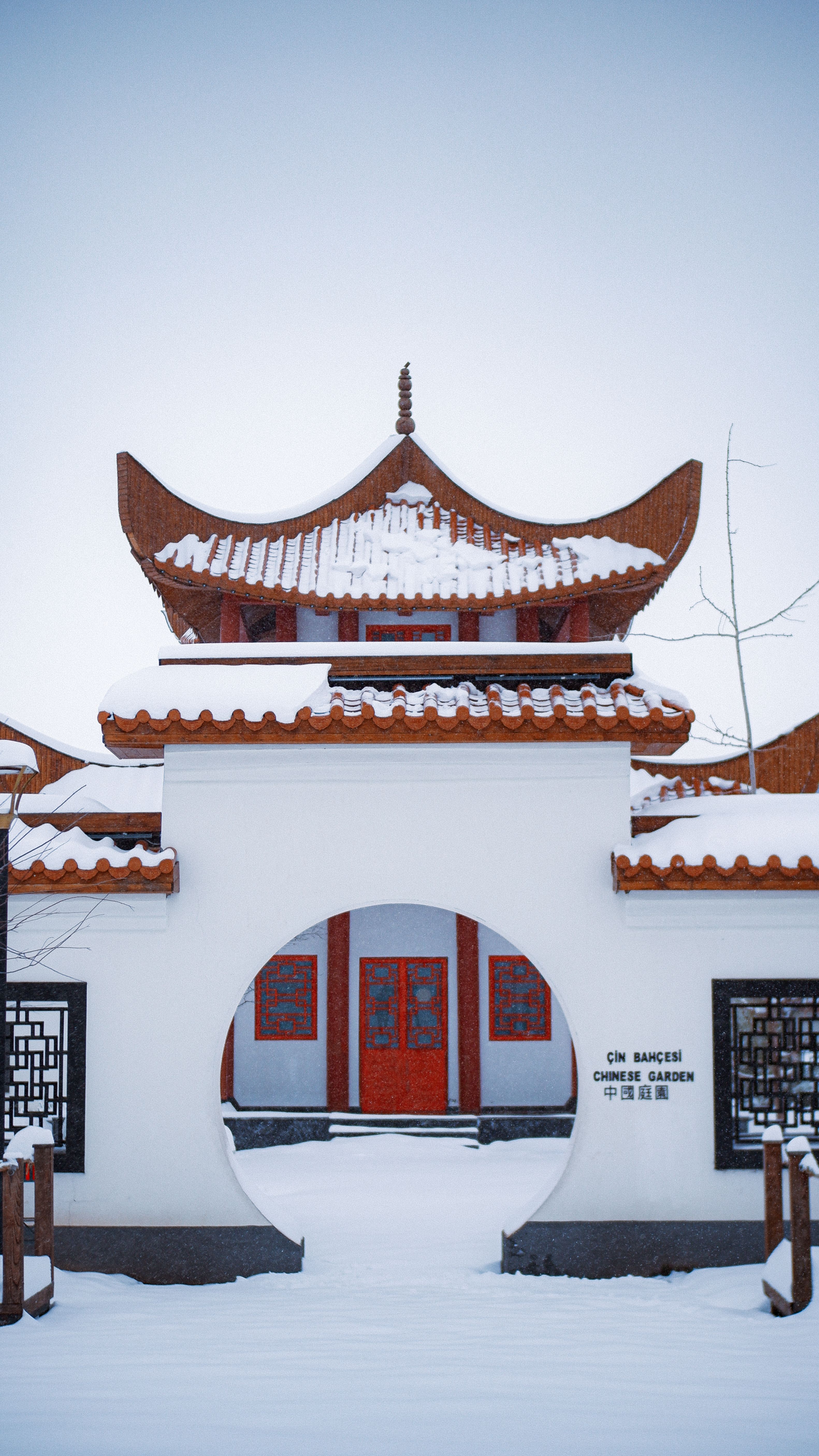 Snow-Covered Chinese Garden Gate in Winter · Free Stock Photo