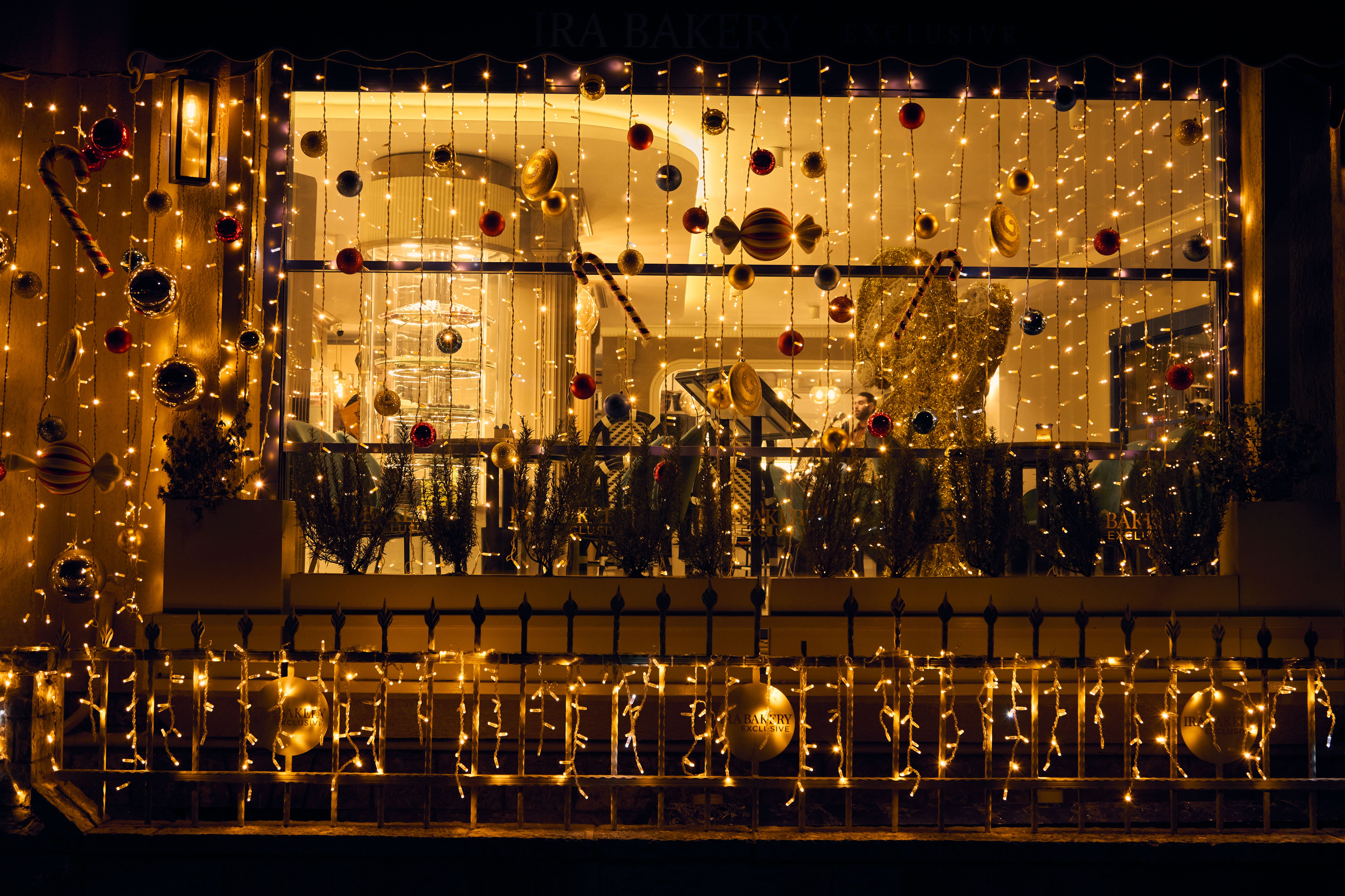 Festive Bakery Window with Holiday Lights · Free Stock Photo