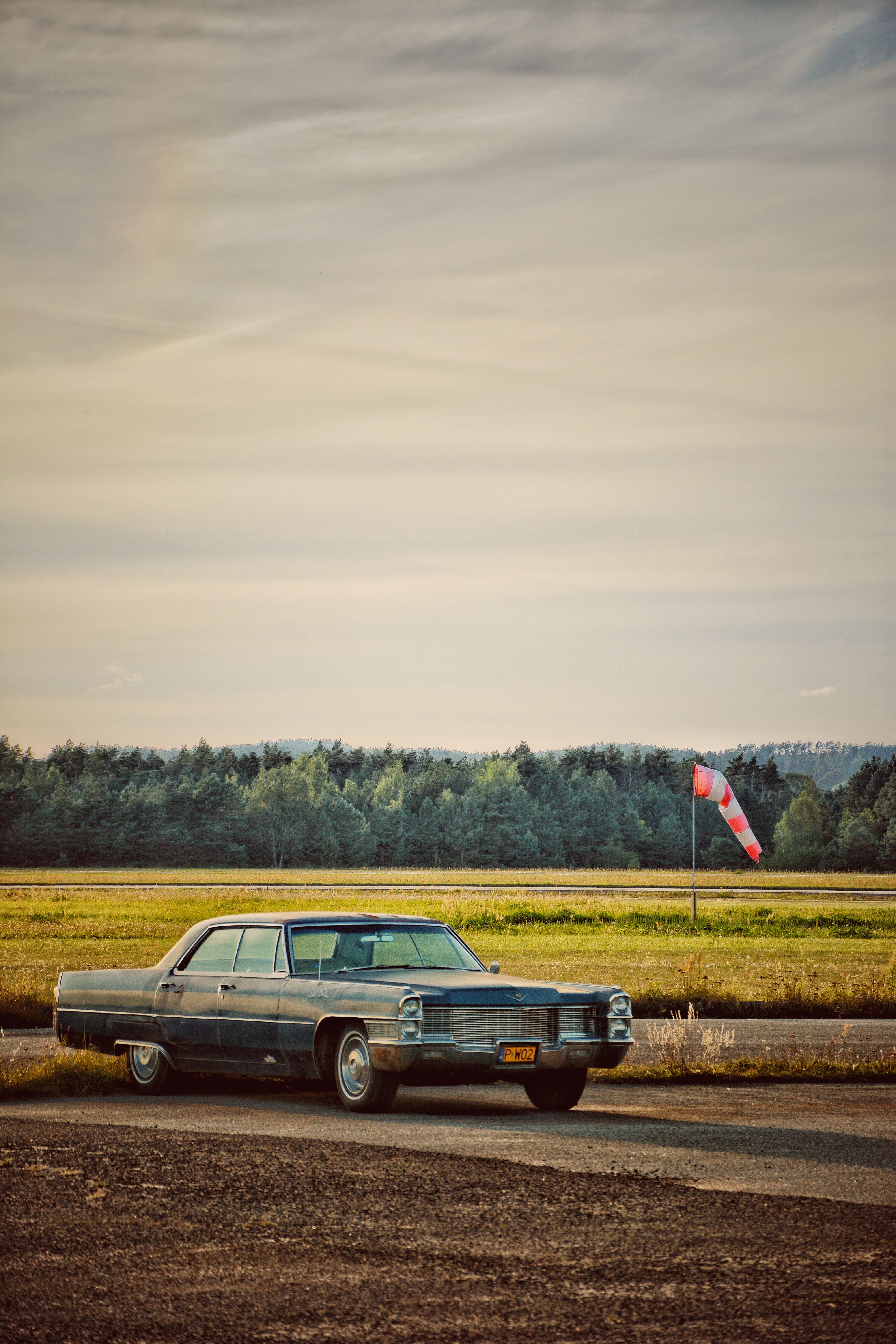 Classic Vintage Car in Open Countryside Setting · Free Stock Photo