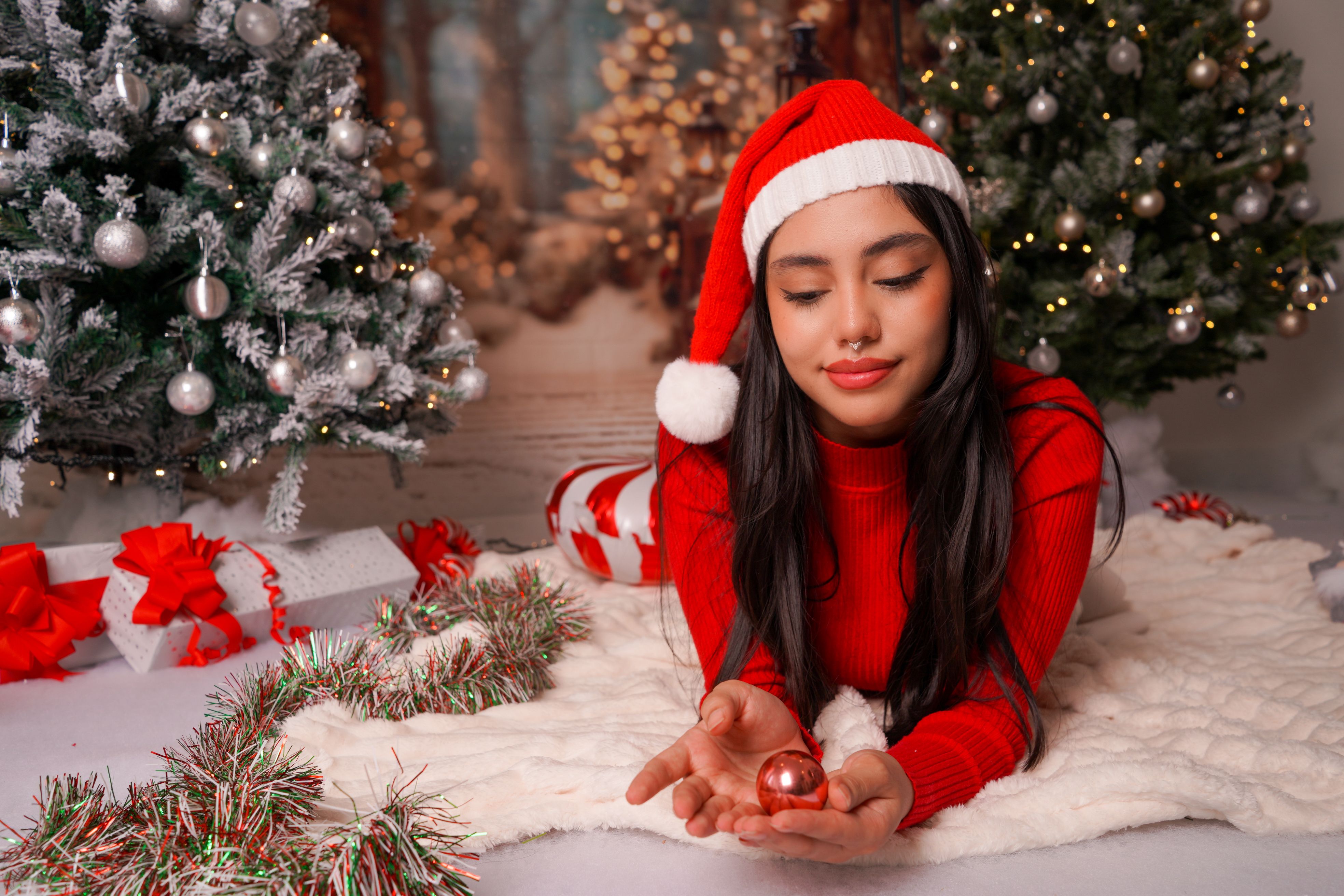 Young Woman Relaxing by Christmas Tree Indoors · Free Stock Photo