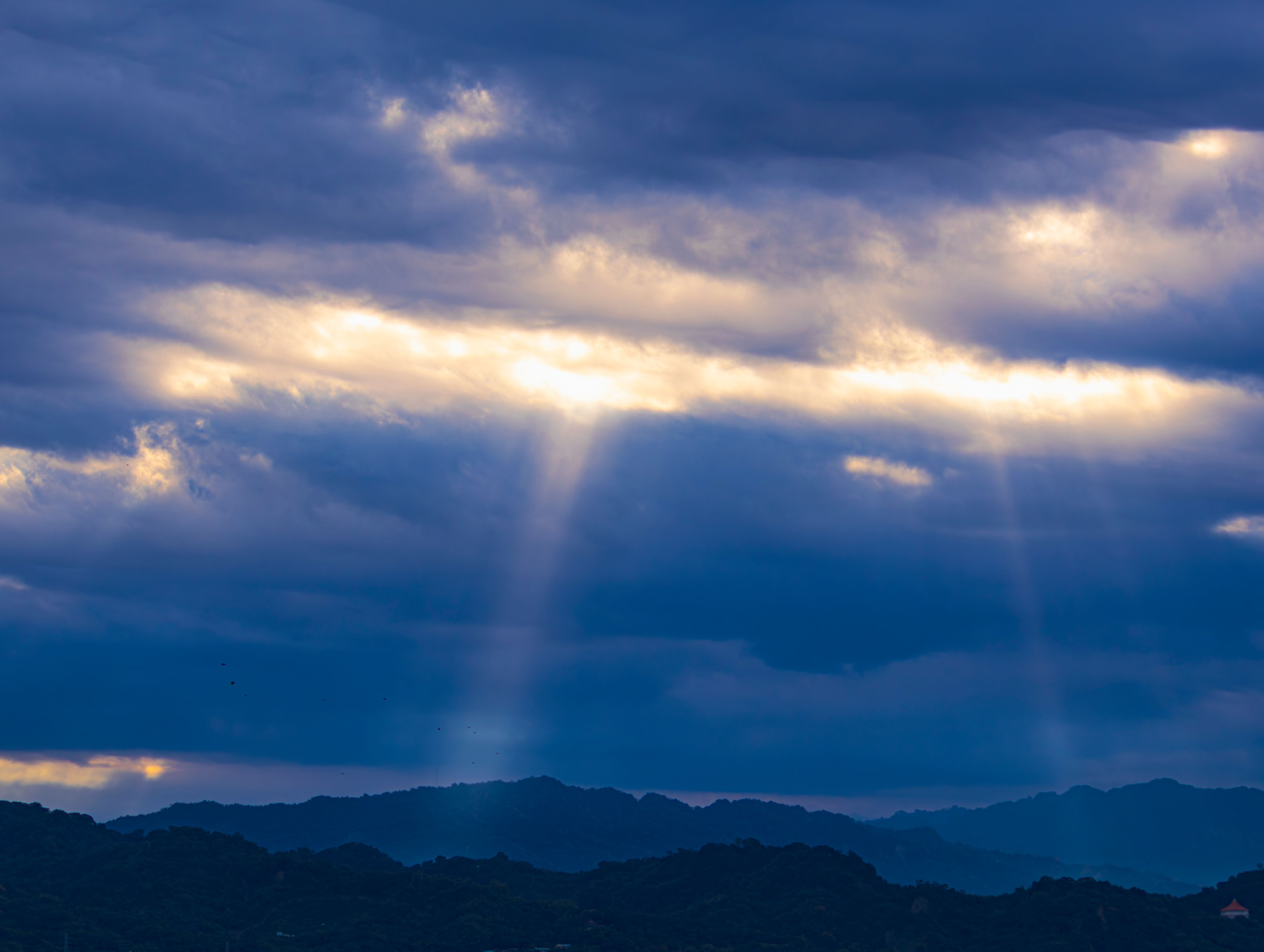 Dramatic Sunbeams Breaking Through Overcast Sky · Free Stock Photo