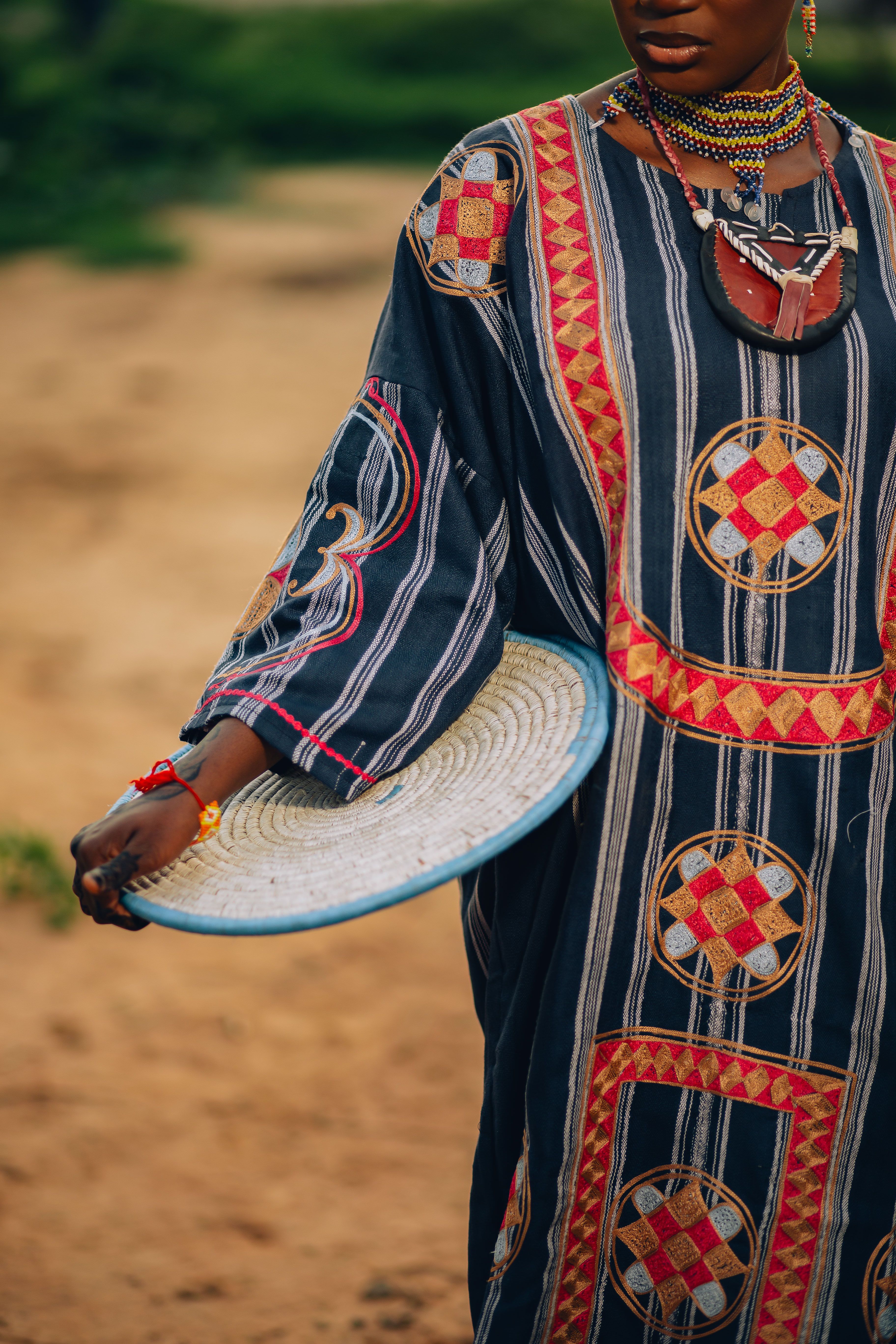 African Traditional Attire with Detailed Patterns · Free Stock Photo