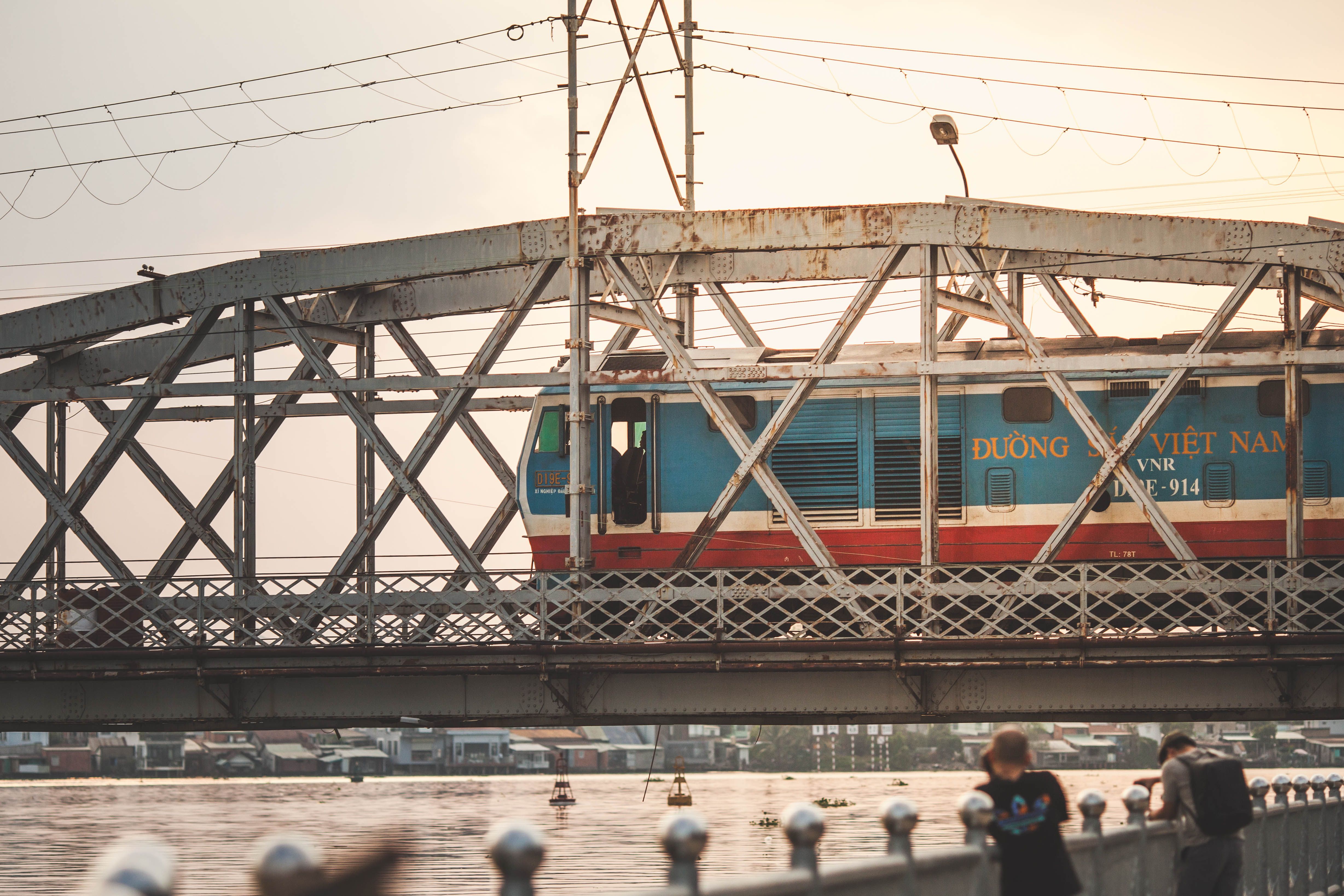 Train Crossing Historic Bridge in Vietnam · Free Stock Photo