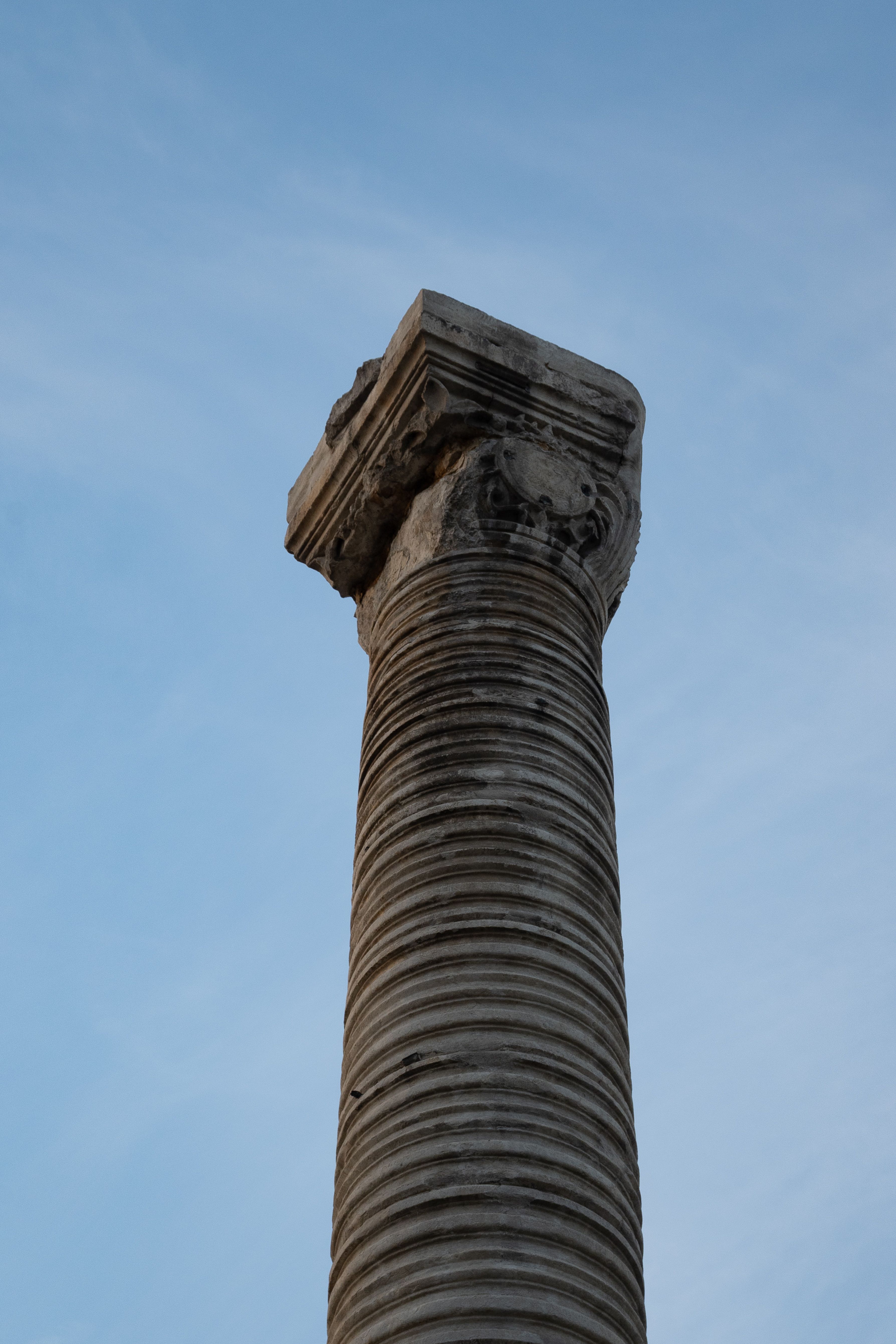 Ancient Stone Column Against Clear Sky · Free Stock Photo