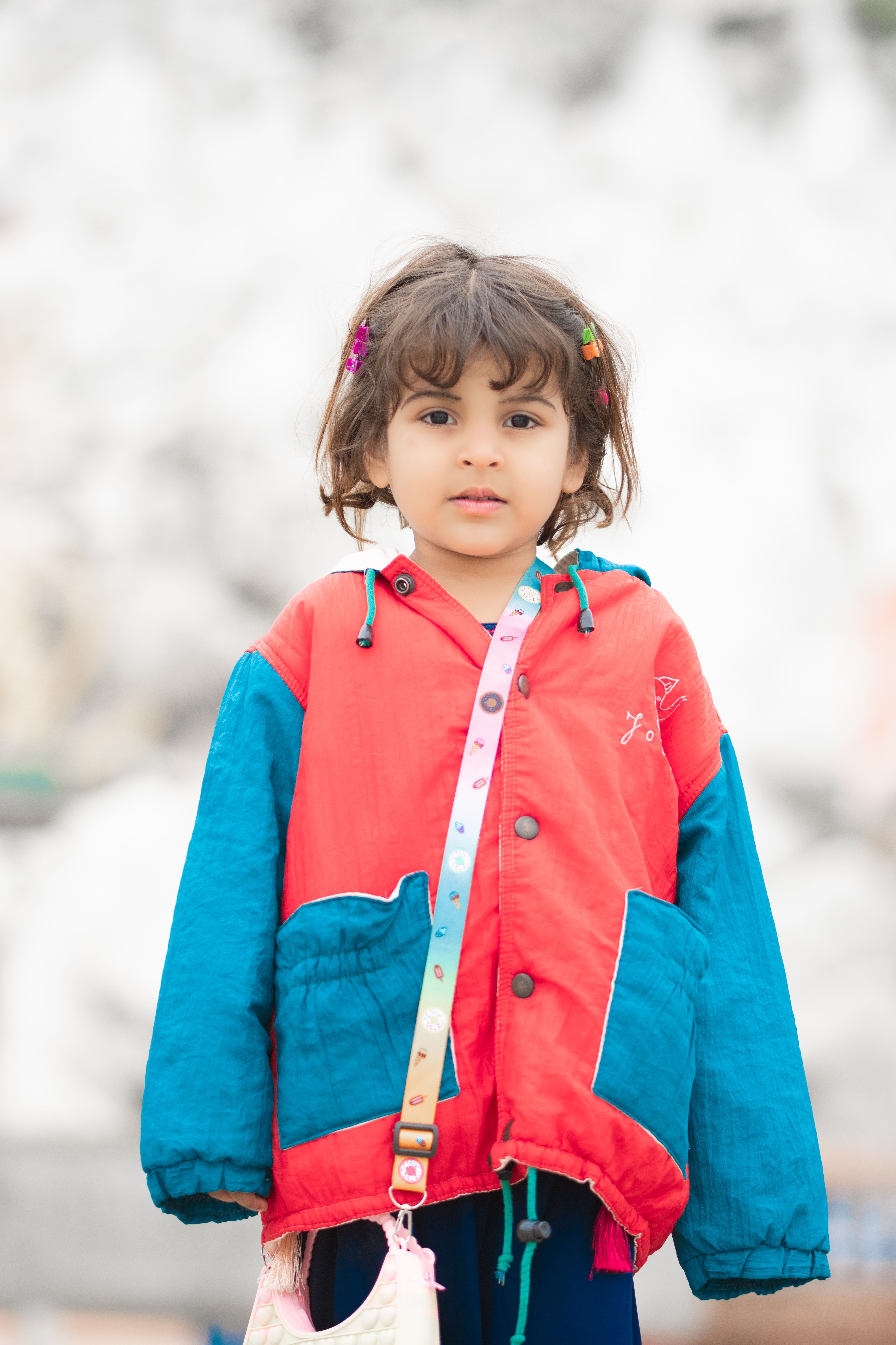 Portrait of a Child in Colorful Winter Jacket · Free Stock Photo