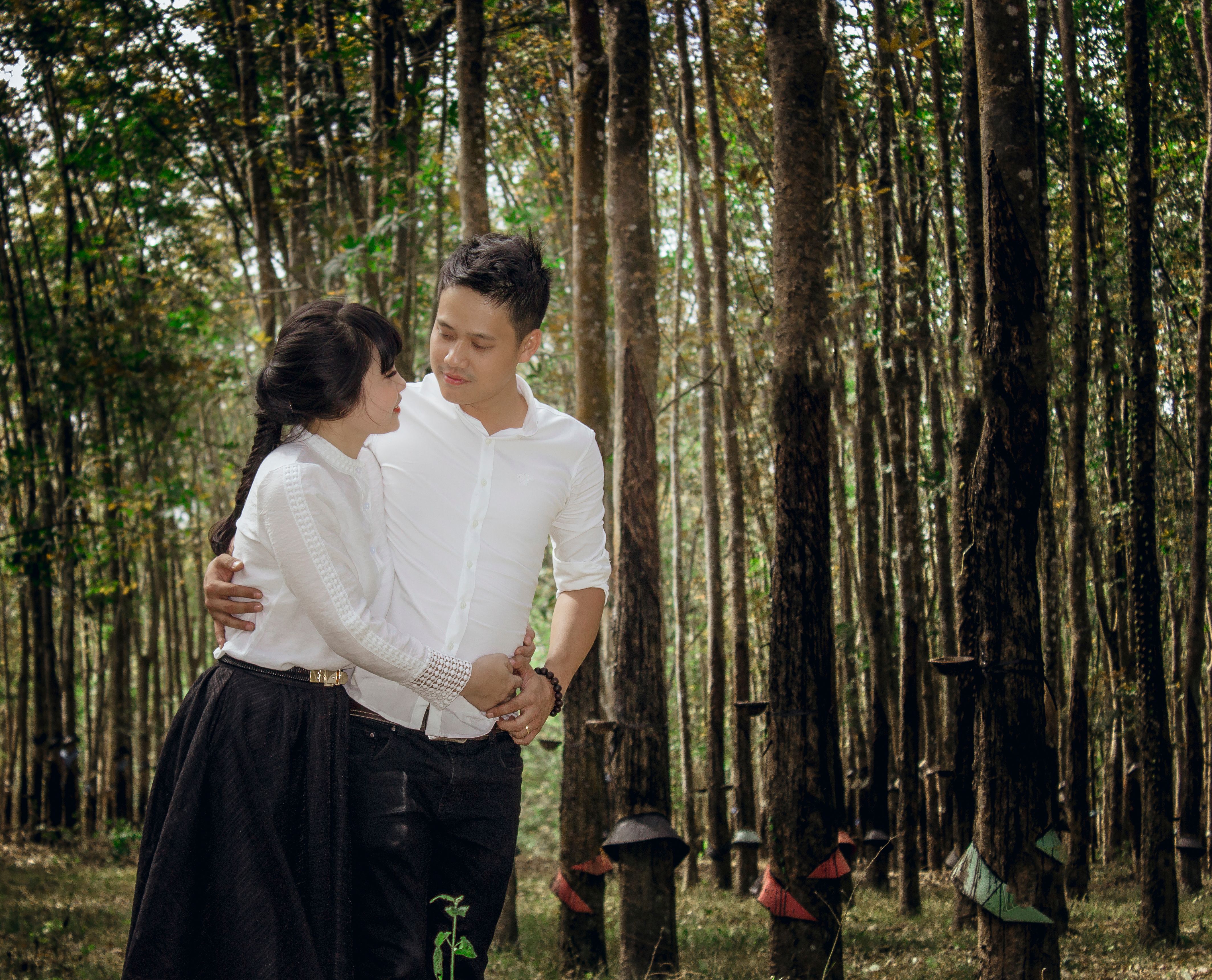 Romantic Couple Embracing in Vietnamese Forest · Free Stock Photo