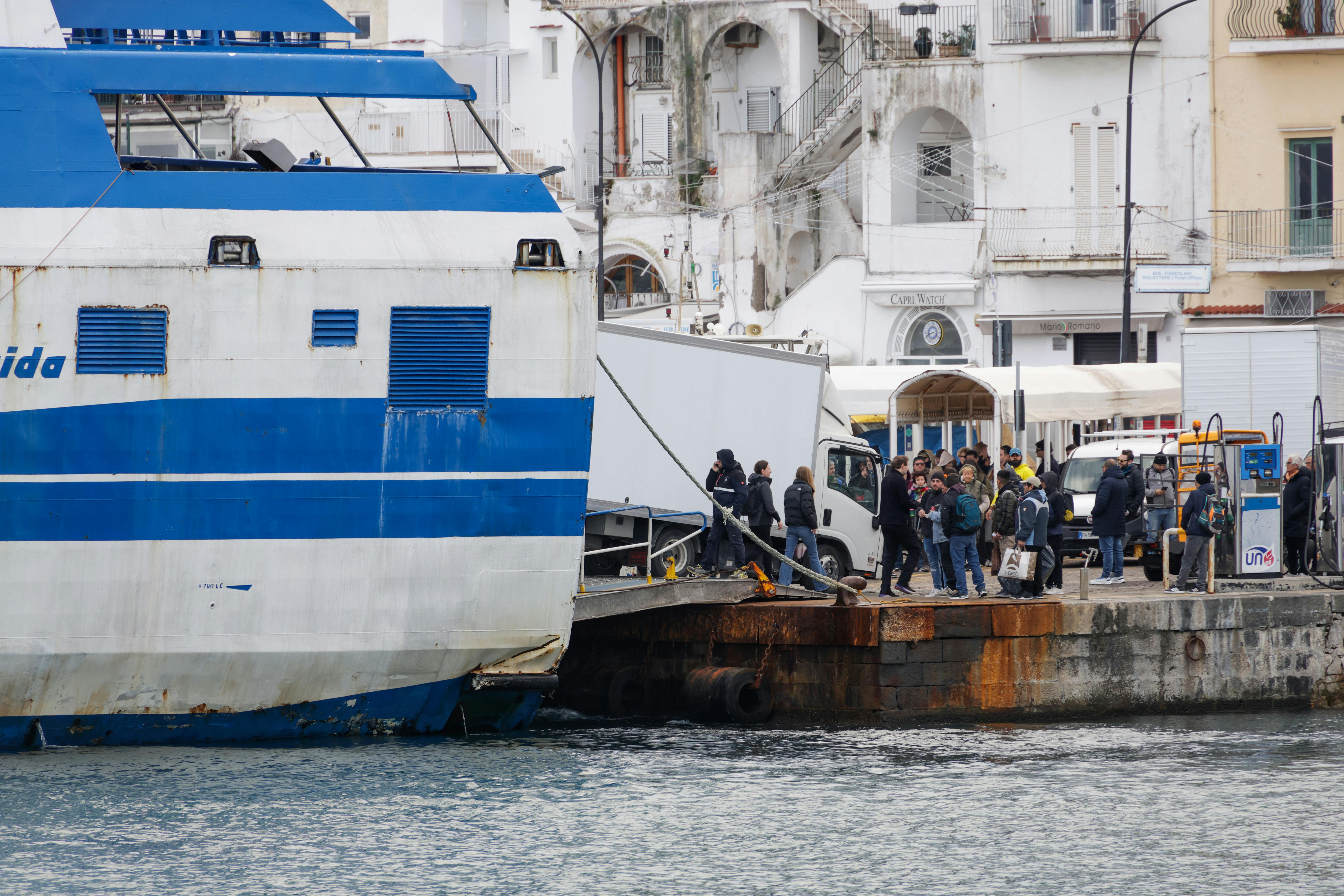 Ferry Dock with Passengers in Mediterranean Harbor · Free Stock Photo