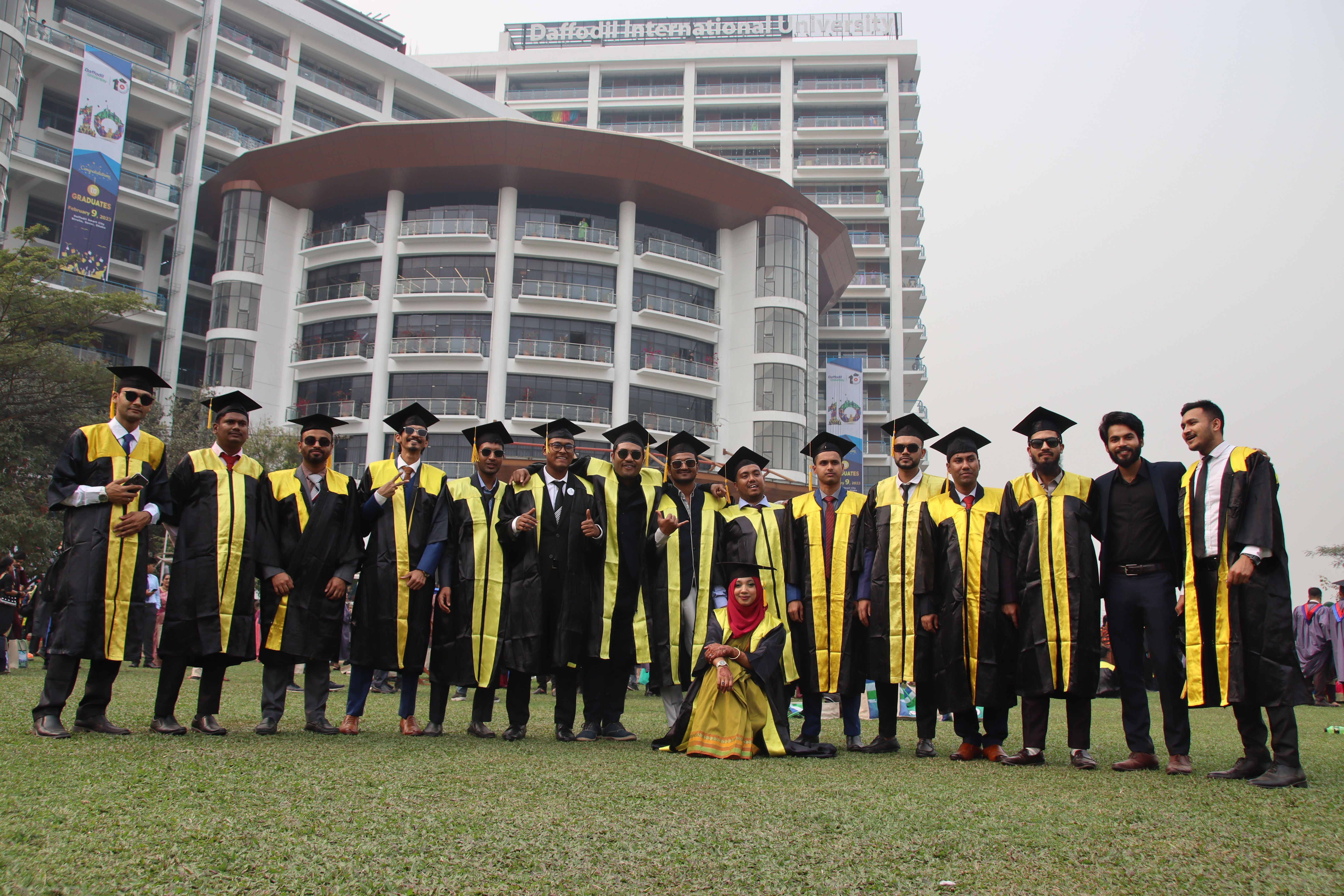 Group of Graduates Celebrate at University Campus · Free Stock Photo